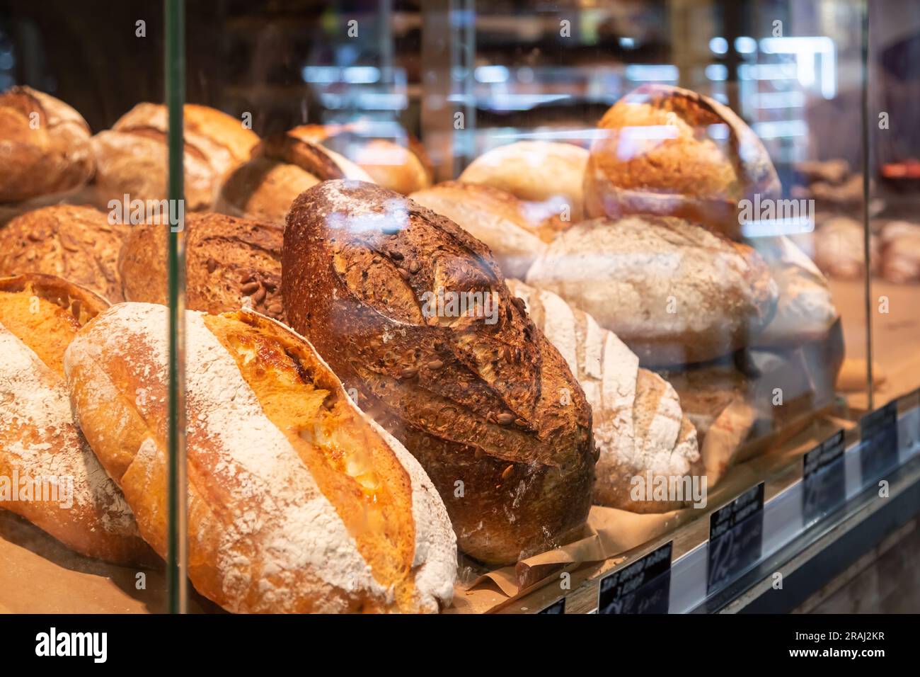 Modern bakery Shop with assortment of bread on shelf Stock Photo - Alamy