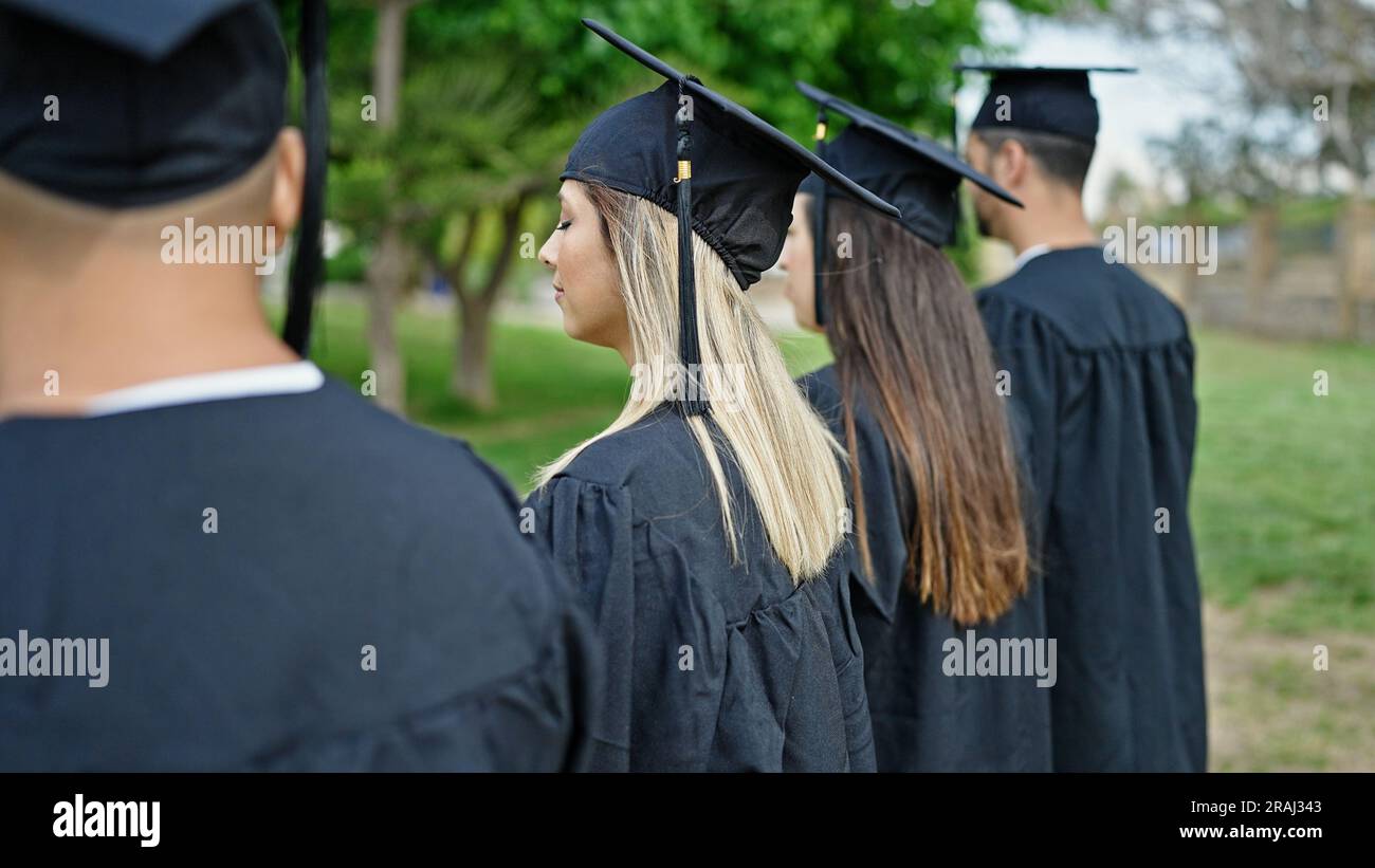 Group of people students graduated standing together backwards at ...