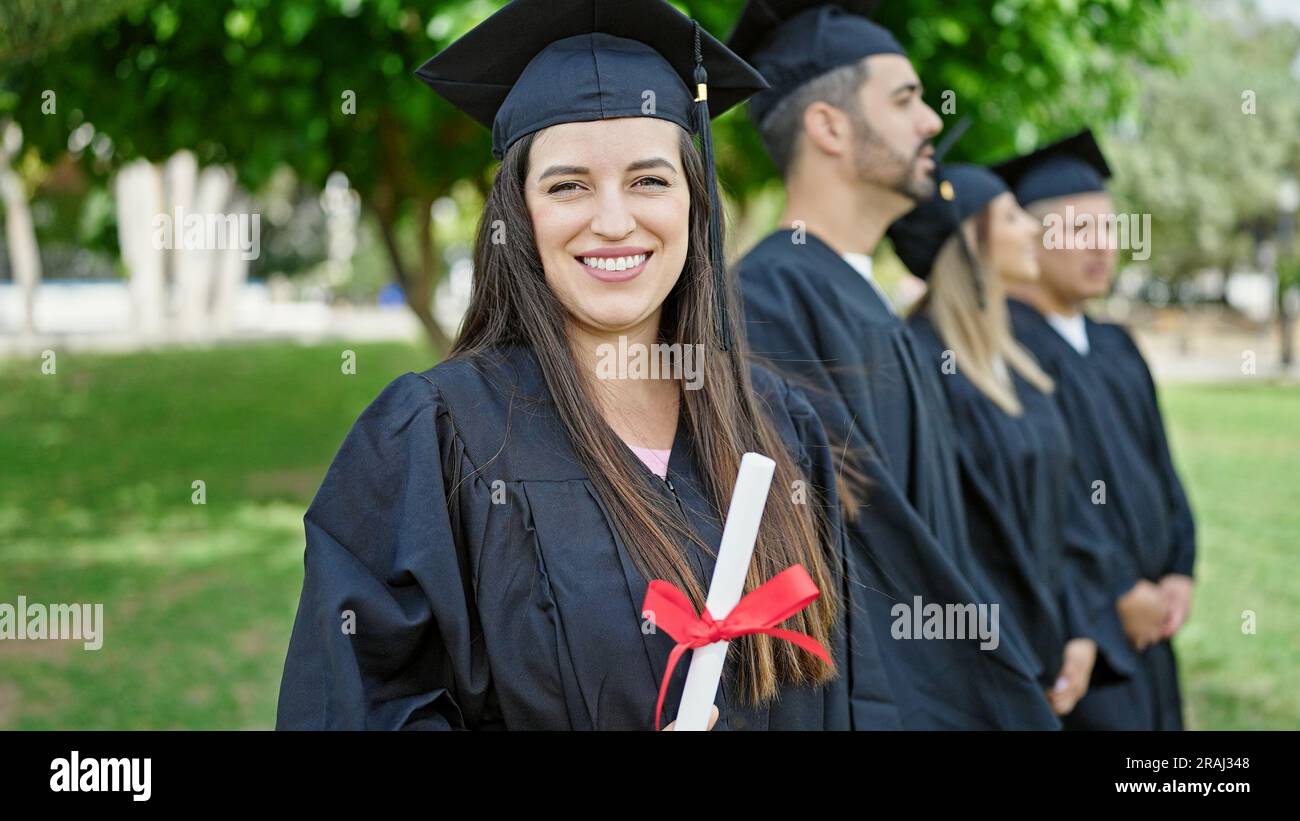 Group of people students graduated holding diploma at university campus ...