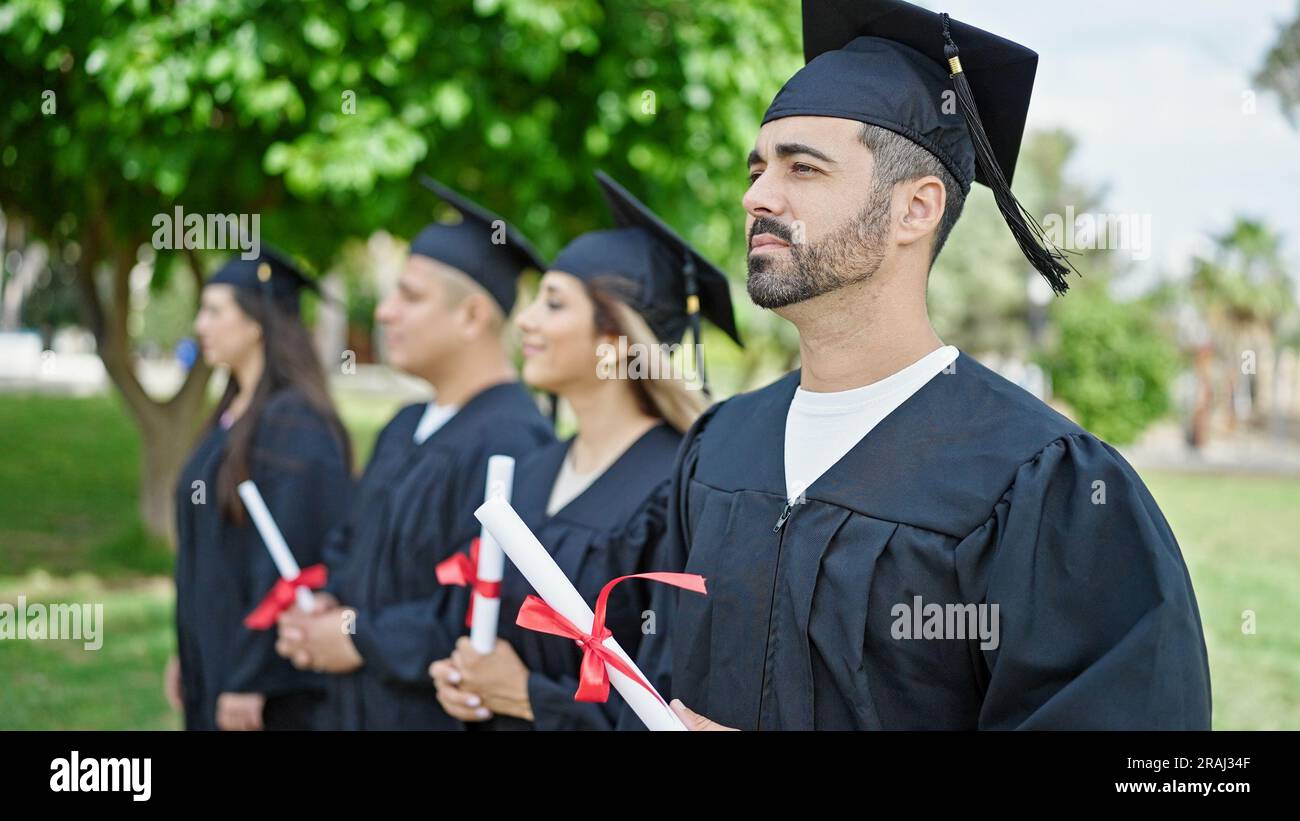 Group of people students graduated holding diploma at university campus ...