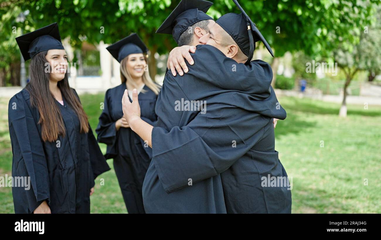 Group of people students graduated smiling confident hugging each other ...