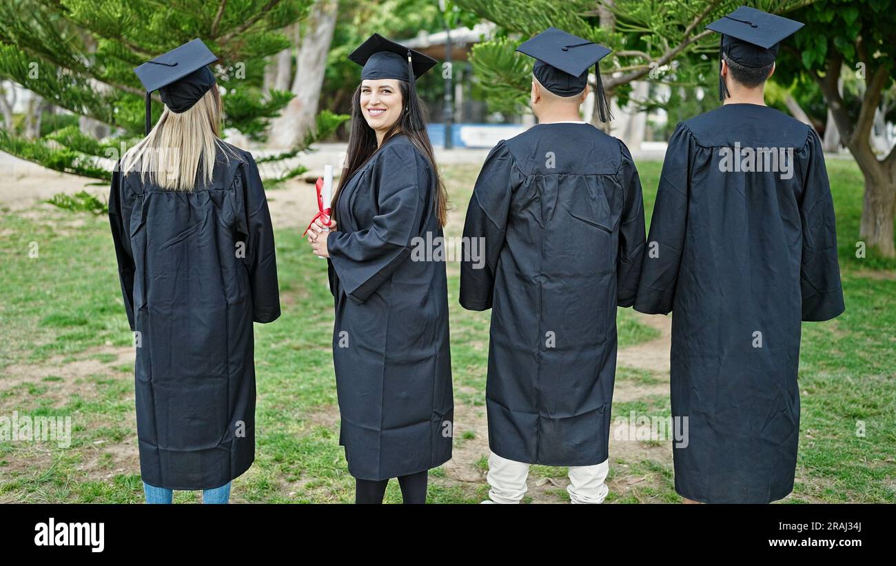 Group of people students graduated holding diploma at university campus ...