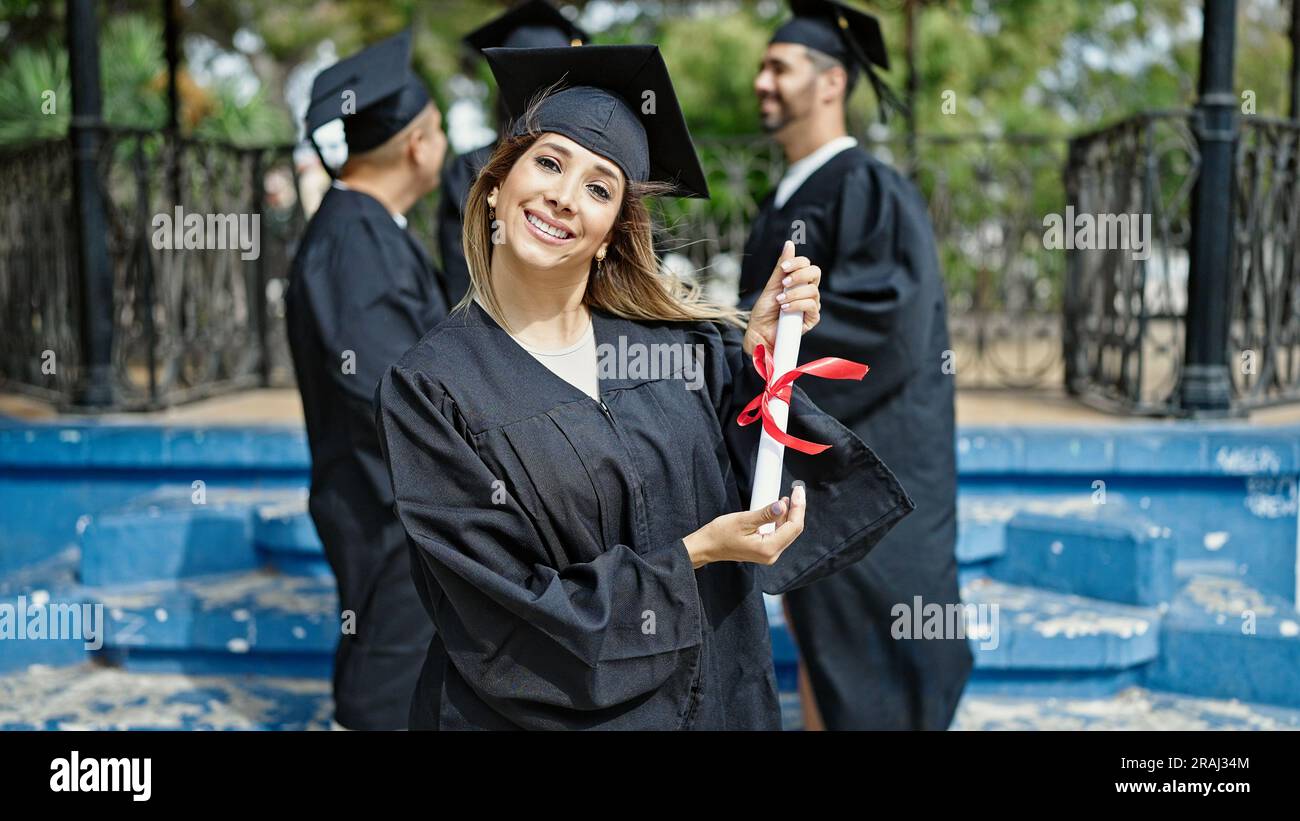 Group of people students graduated holding diploma at university campus ...