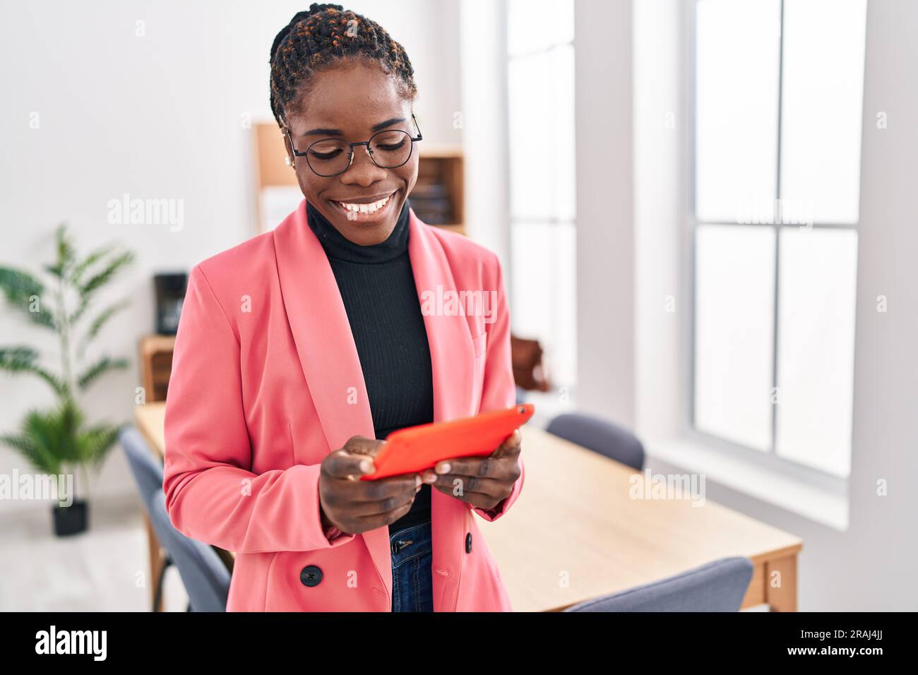 African american woman business worker using touchpad standing at ...