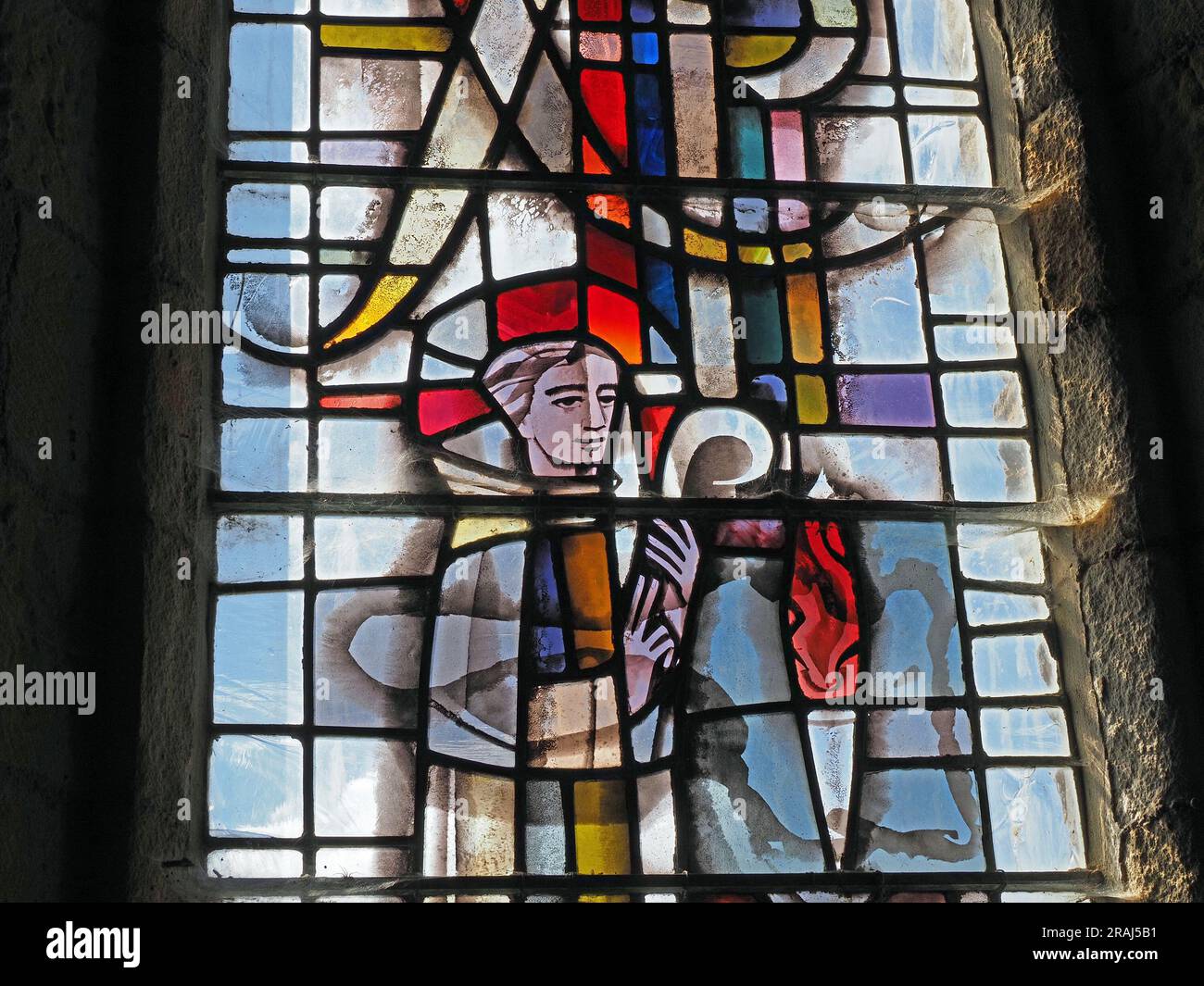 light shining through new coloured stained glass window depicting St ...