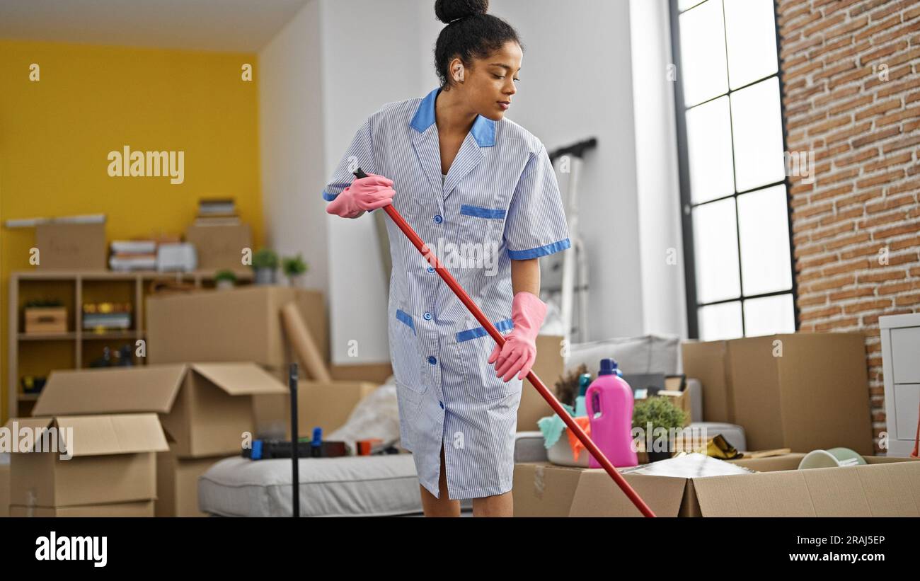 African american woman clean professional washing floor dancing at new ...