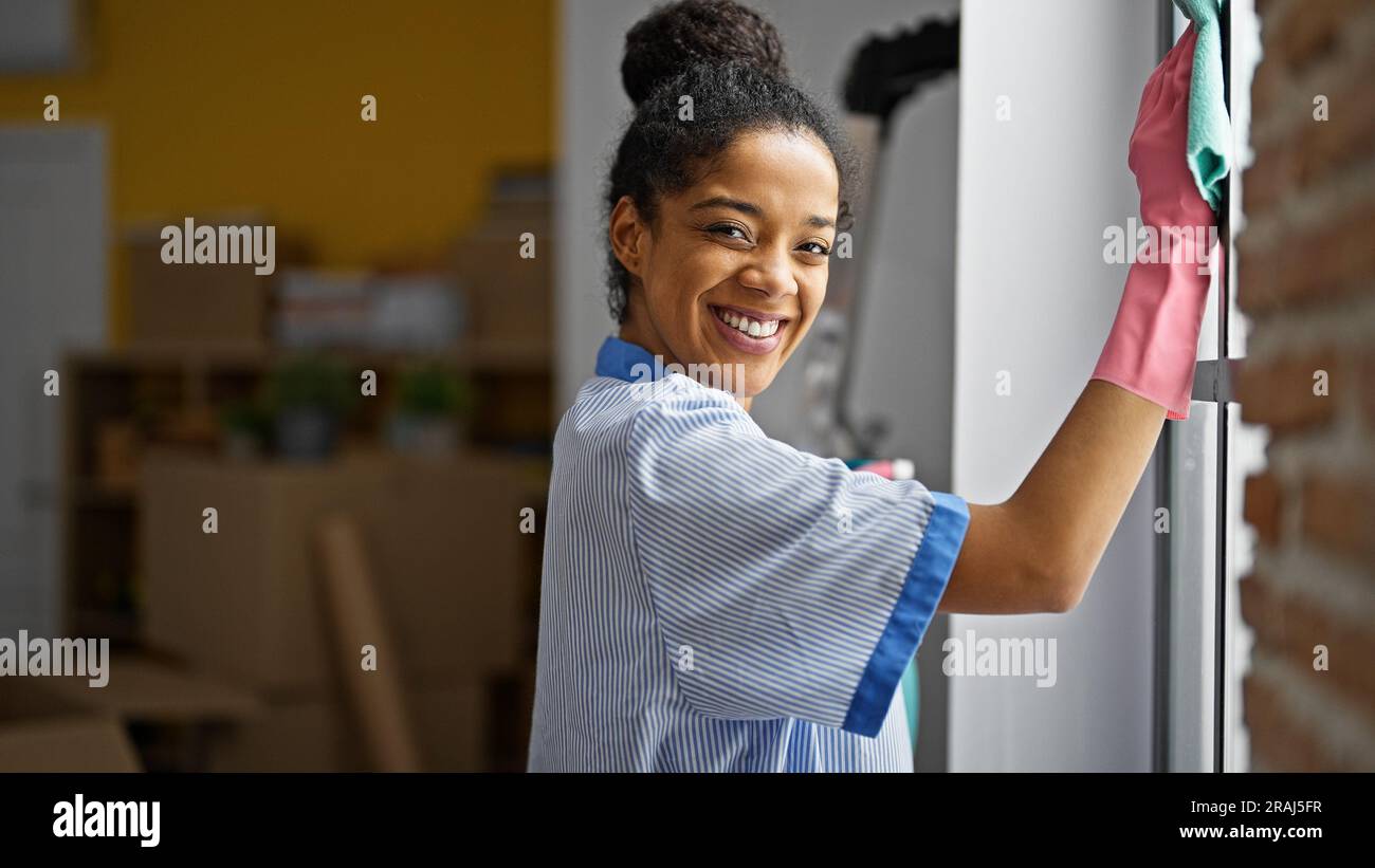 African american woman clean professional cleaning window at new home ...