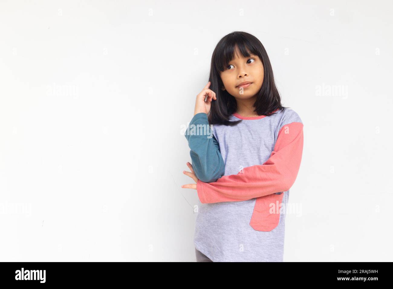A smart girl thinking an idea Stock Photo - Alamy