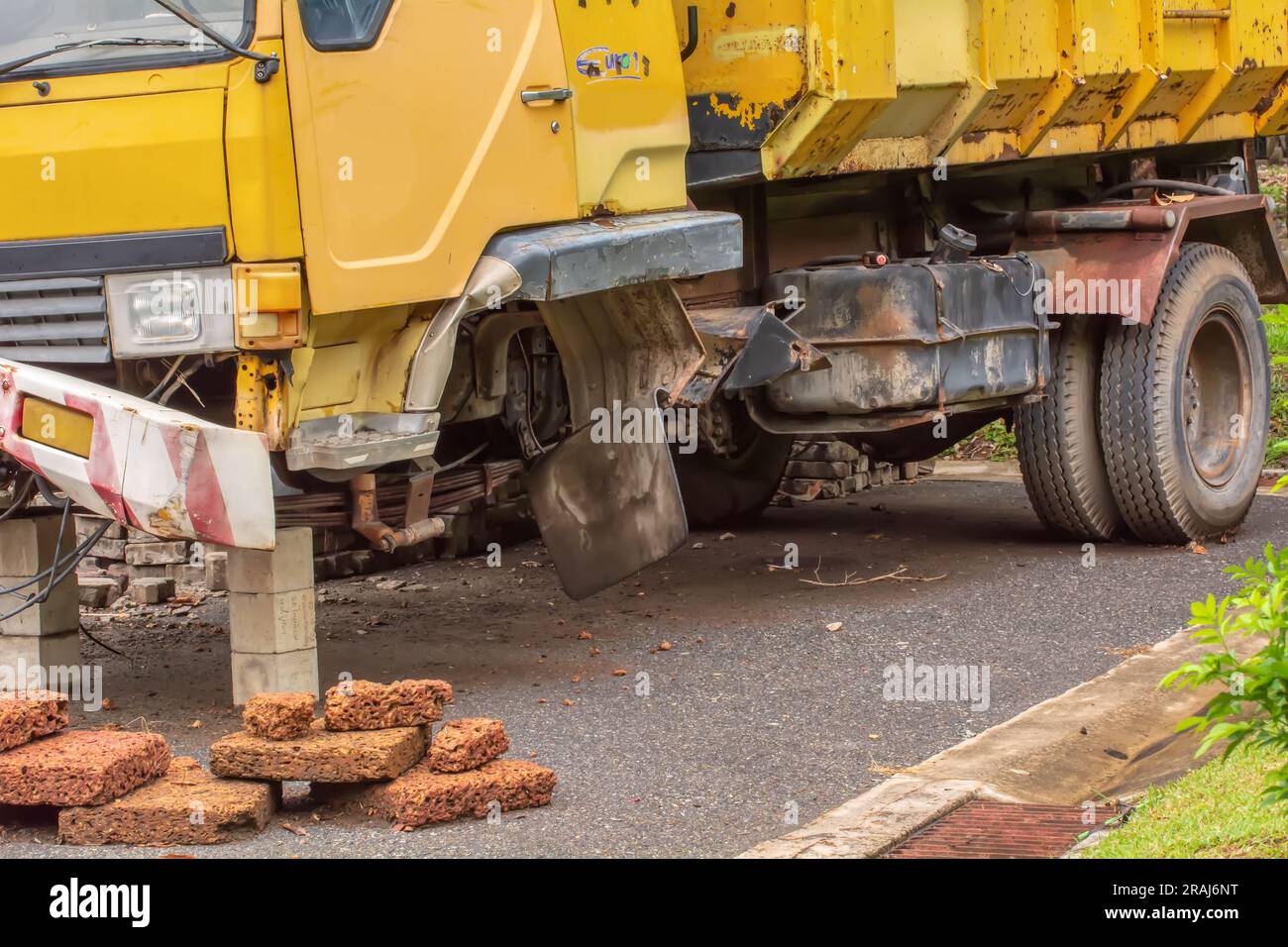 The broken yellow car is no longer usable Stock Photo - Alamy
