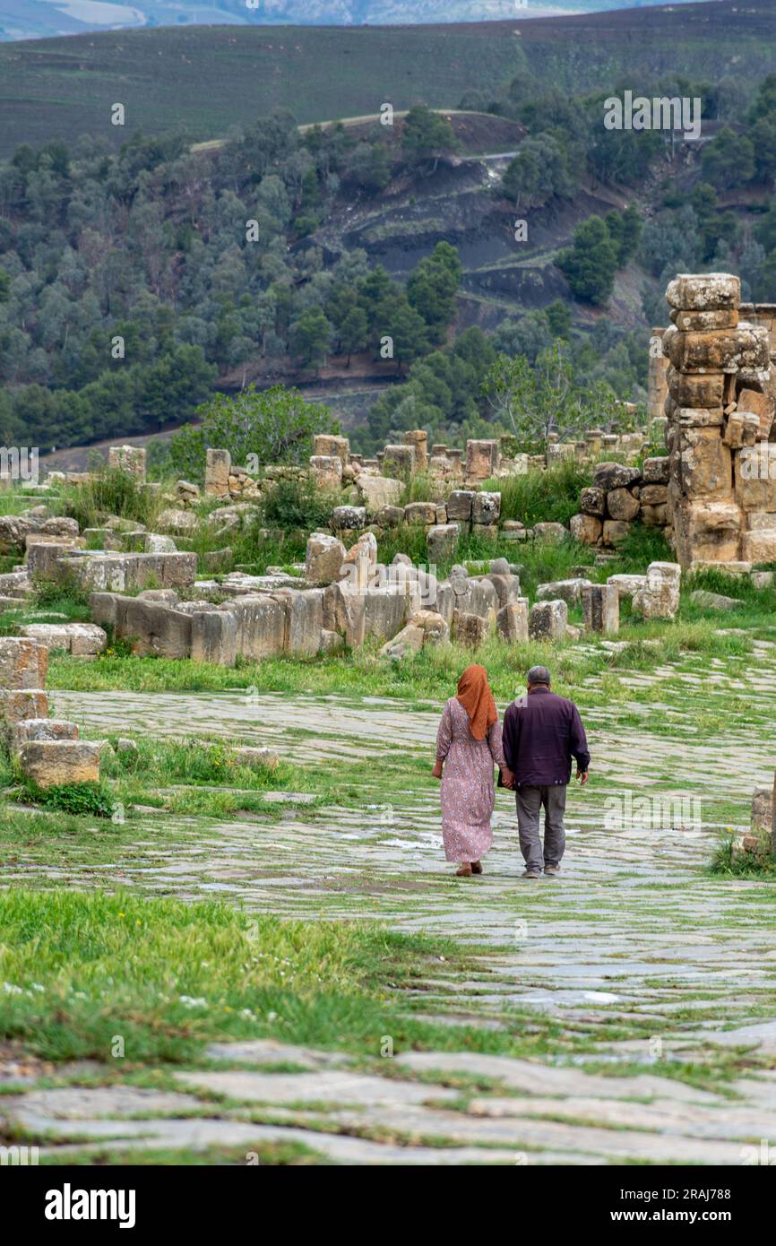 Algerian couple walking in the ancient Roman town of Cuicul. UNESCO ...