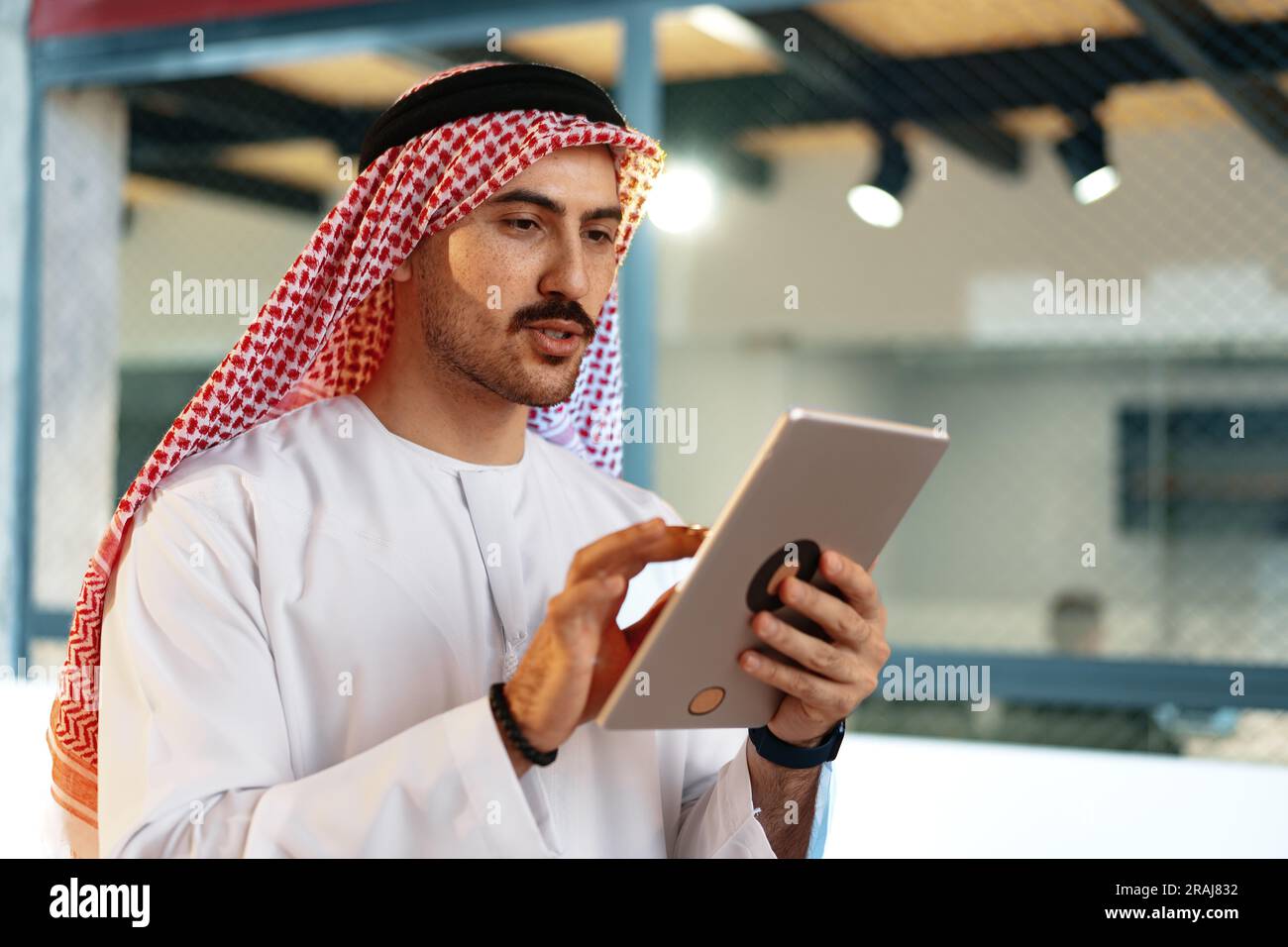 Arab muslim businessman using digital tablet in modern office Stock ...