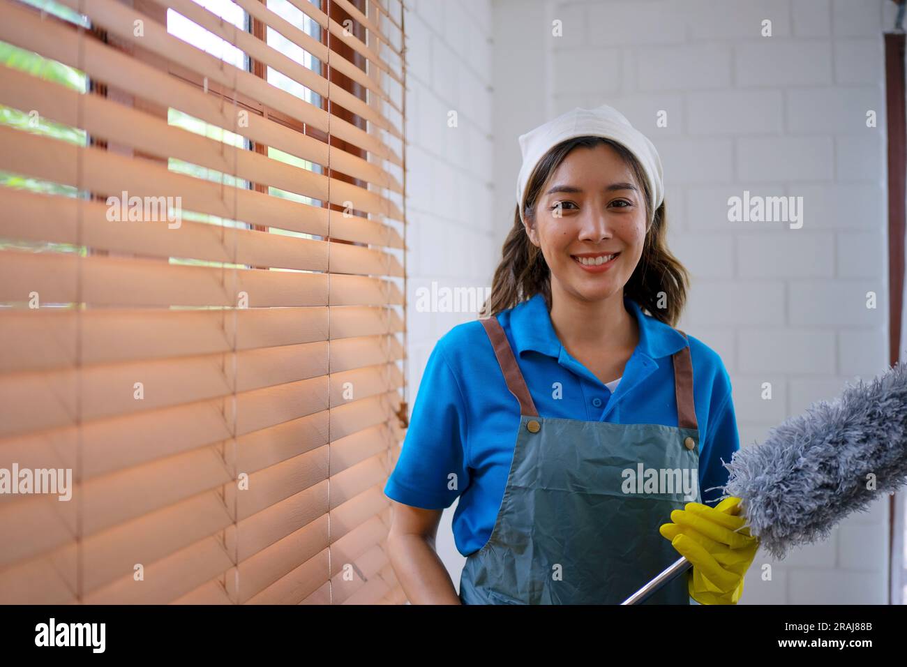 House keeper clean living room. Cleaning service and house keeping ...