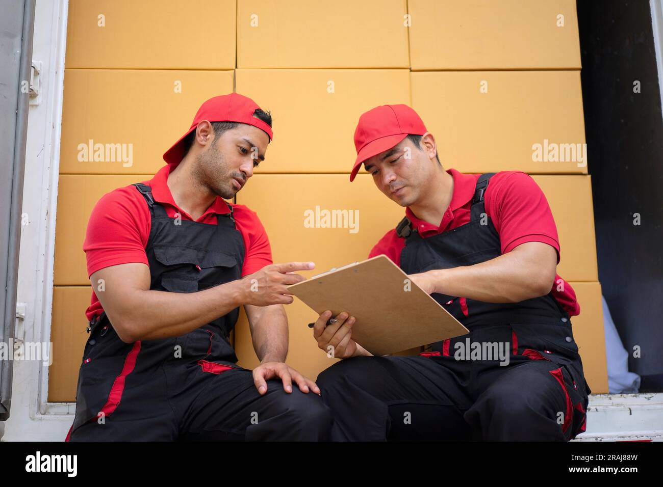 Delivery man move items to the house. Service and delivery concept ...