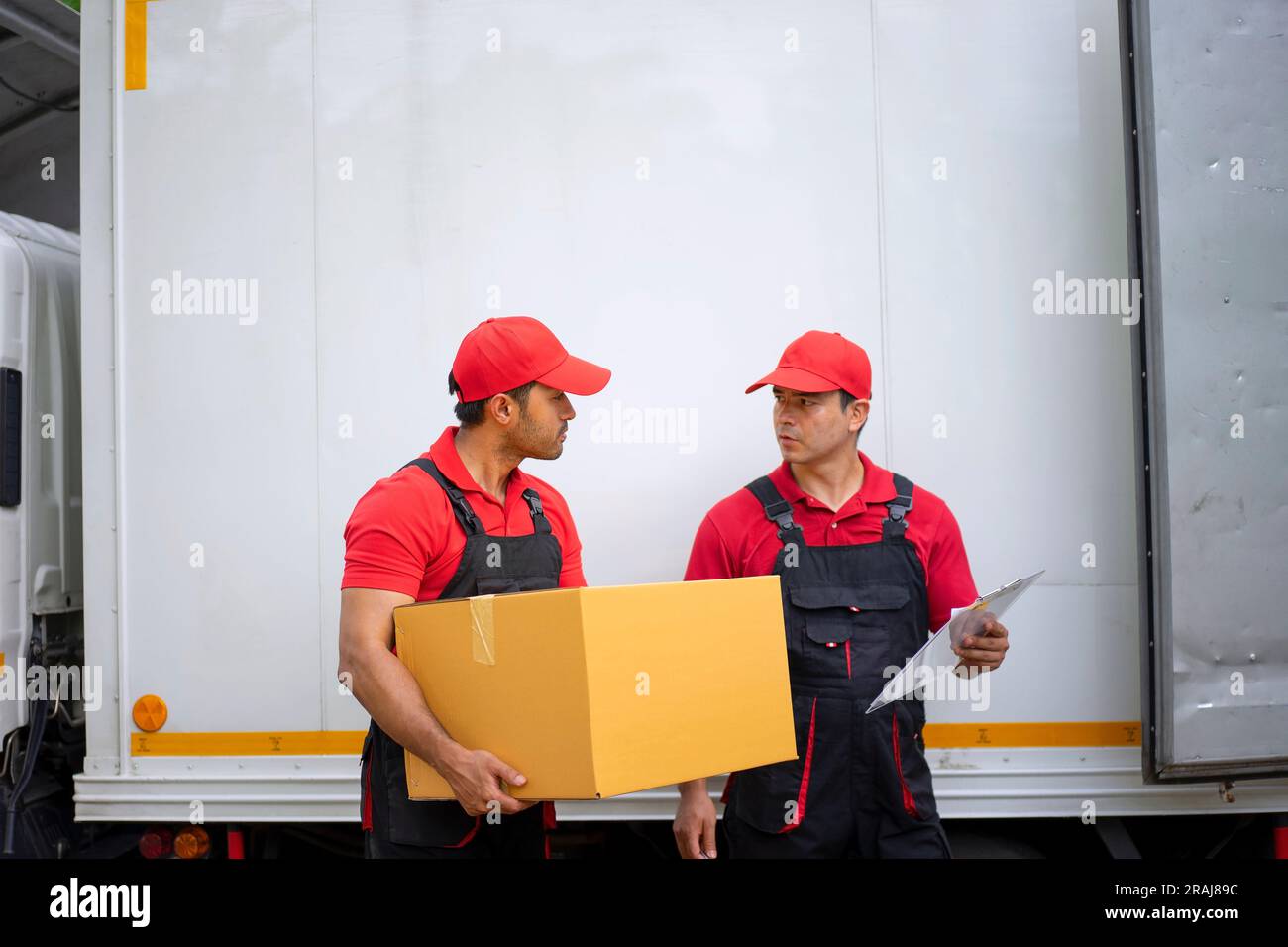 Delivery man move items to the house. Service and delivery concept ...
