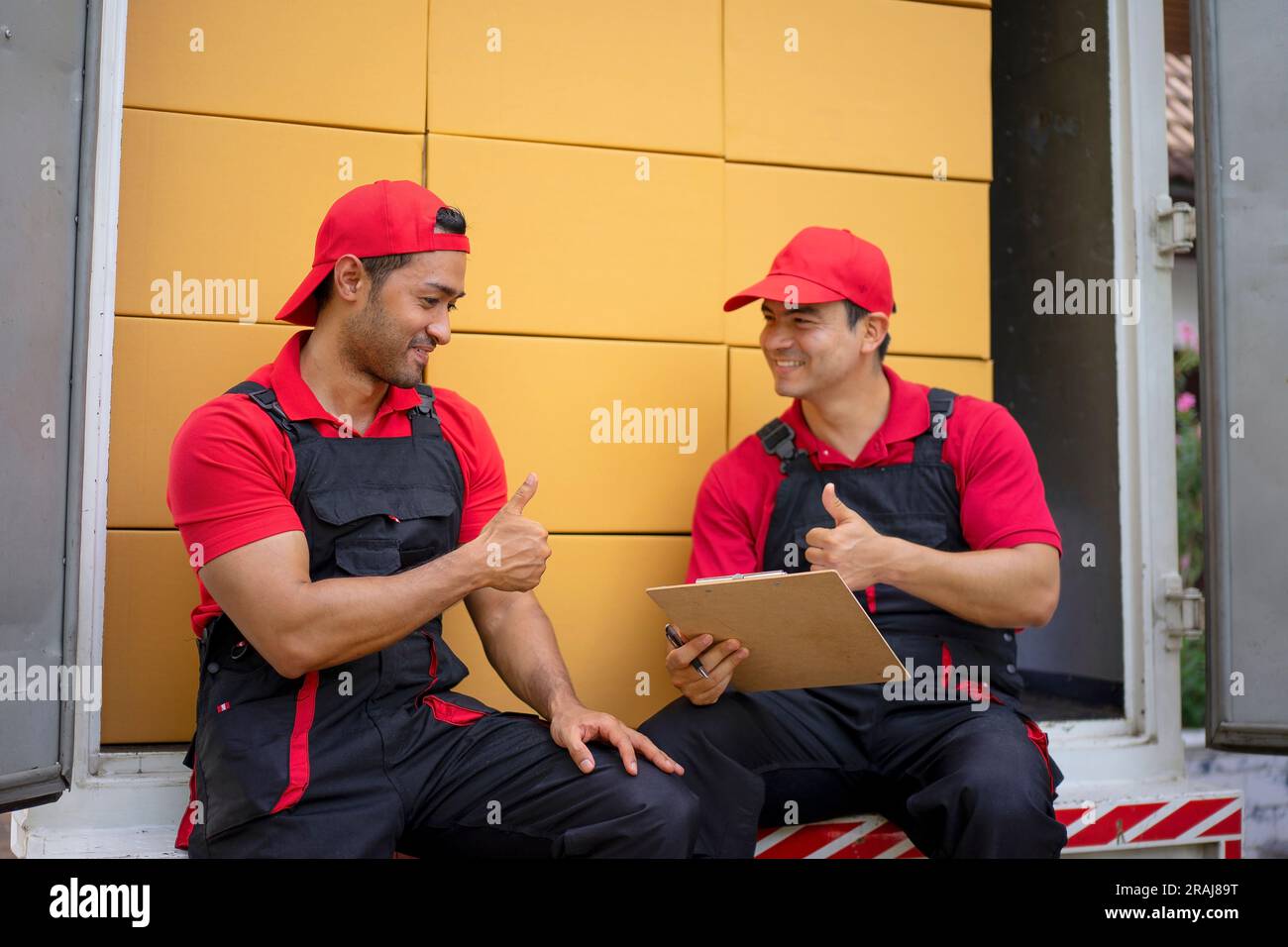 Delivery man move items to the house. Service and delivery concept ...