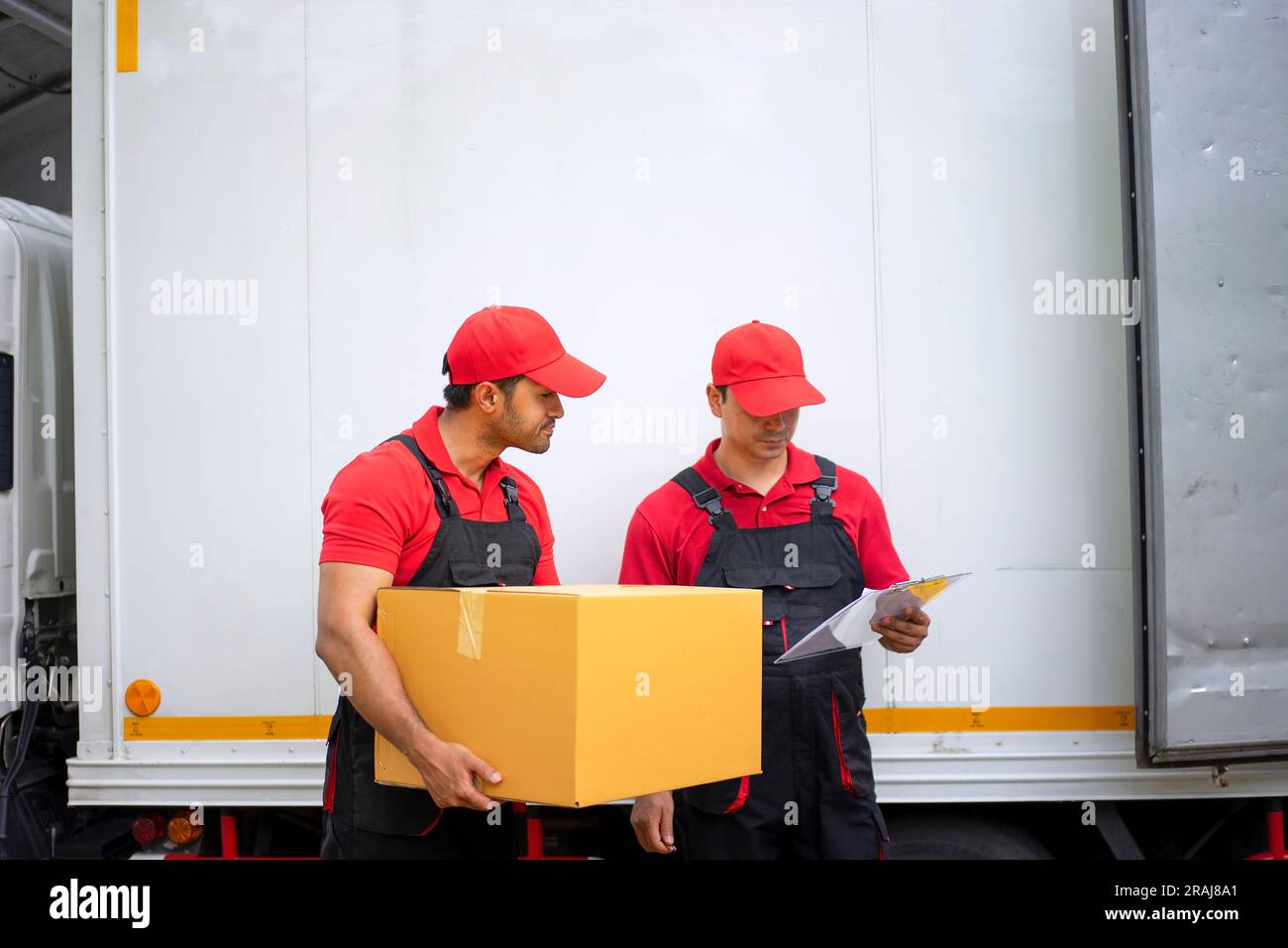 Delivery man move items to the house. Service and delivery concept ...
