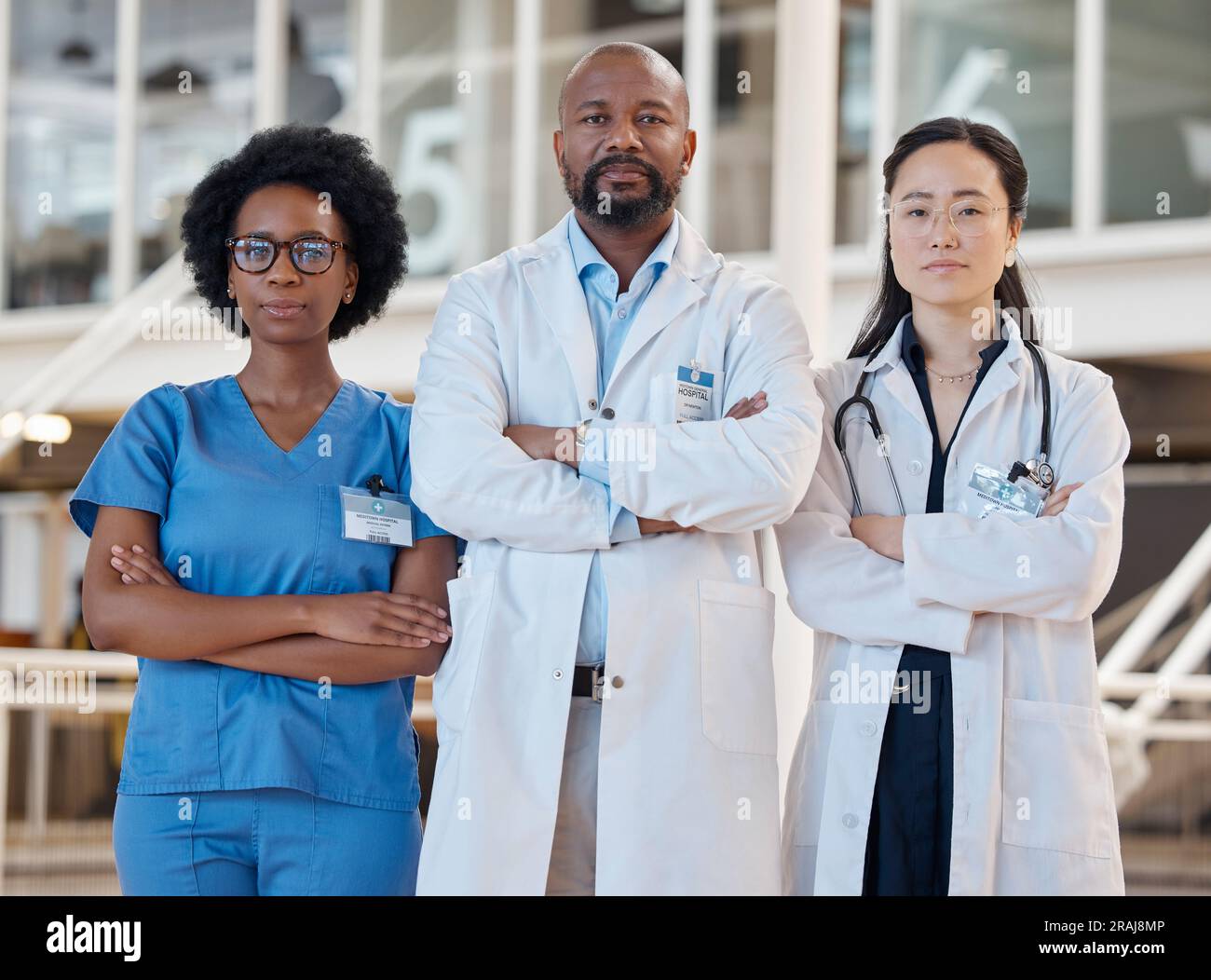 Portrait, serious and team of doctors with arms crossed in hospital, healthcare support and ...
