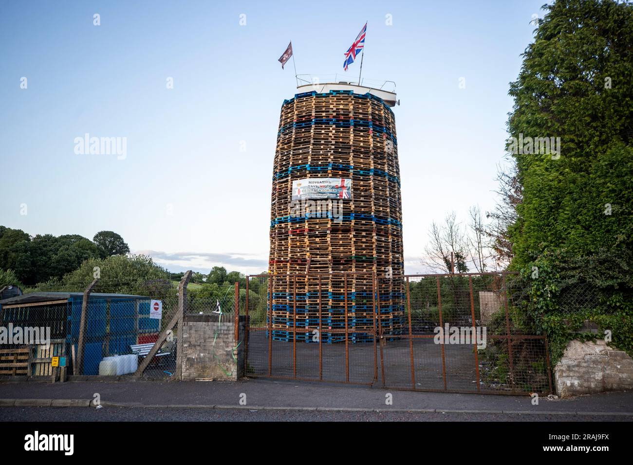 A boat flying the Union Jack flag placed on the top of the pyre with a ...