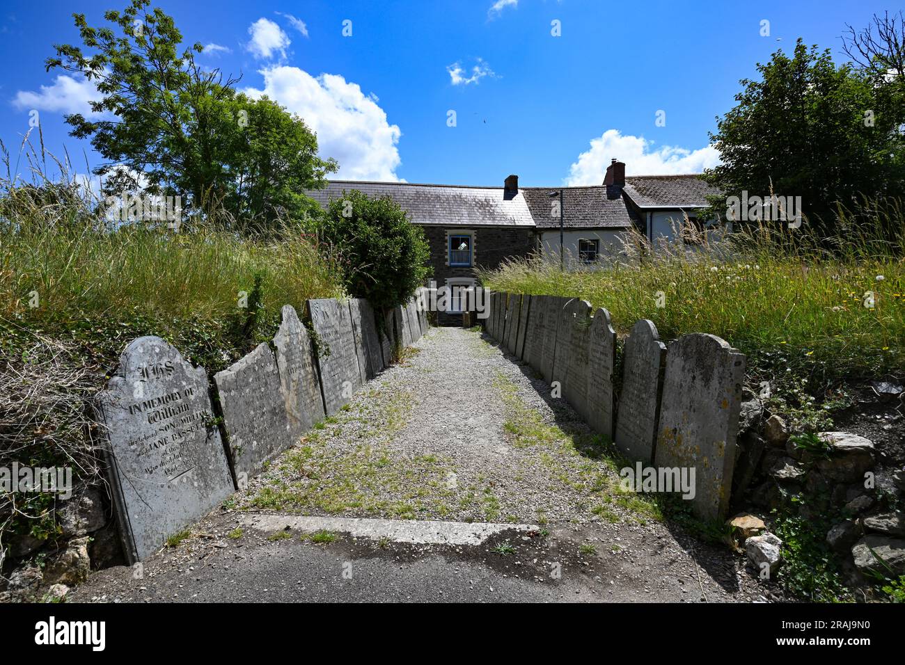 ST NEWLYN EAST CHURCH AND GRAVE YARD WITH HEADSTONES AND PATH LINE WITH ...