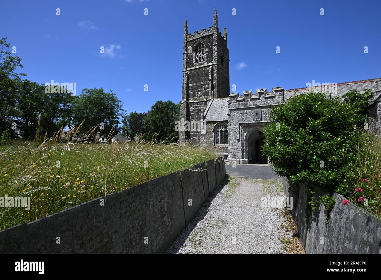 ST NEWLYN EAST CHURCH AND GRAVE YARD WITH HEADSTONES AND PATH LINE WITH ...
