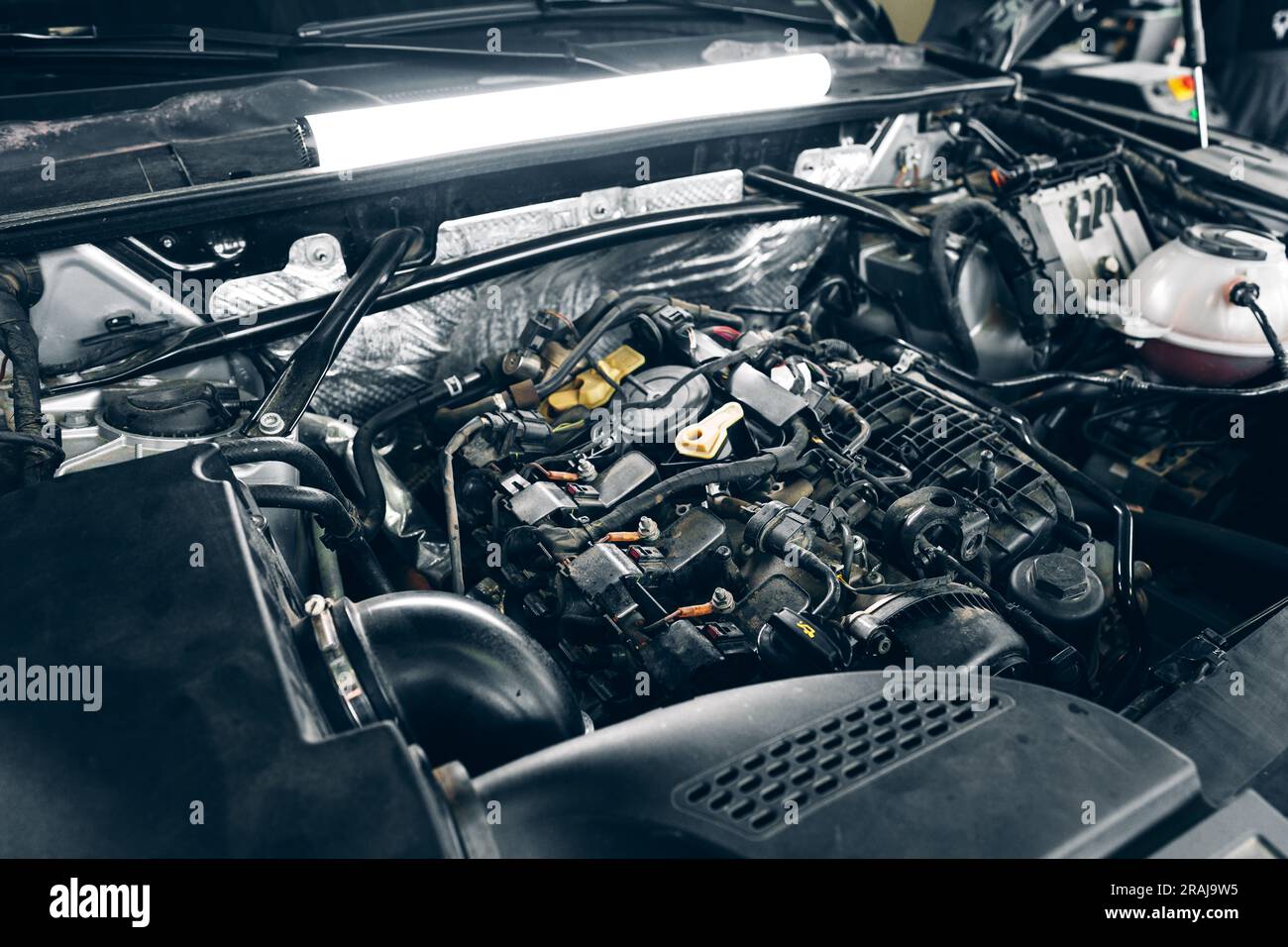 Close up of powerful car engine under the hood Stock Photo - Alamy