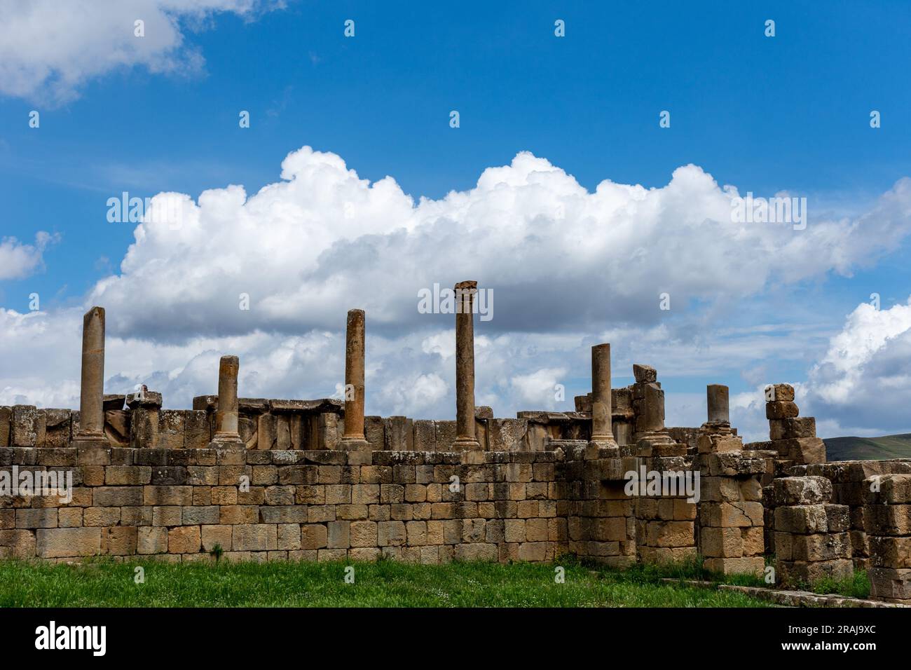 Roman columns against a blue sky in the ancient town of Cuicul. UNESCO ...