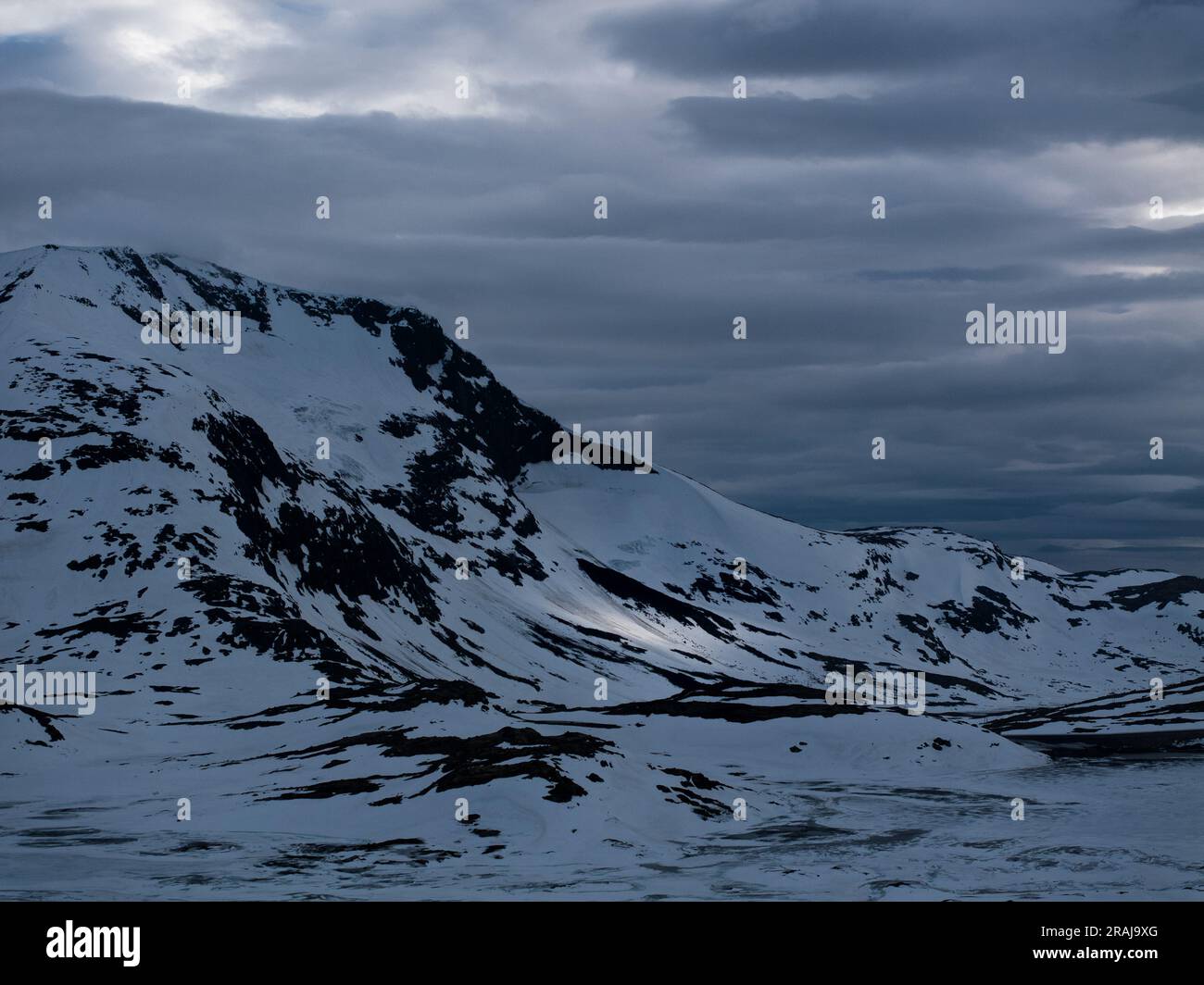 Small spot light on a slope of a mountain Stock Photo - Alamy