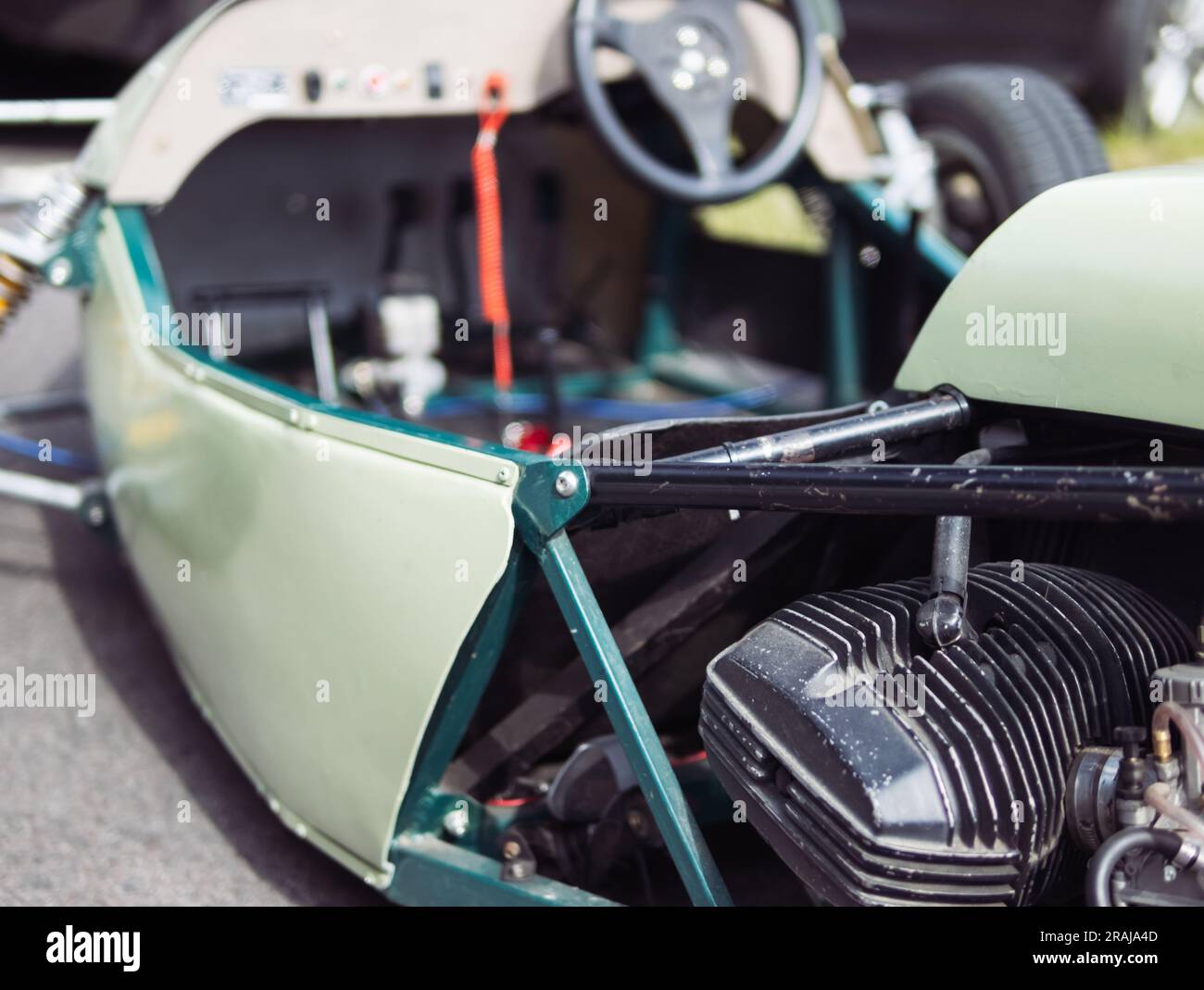 rare racing car disassembled, close-up on the motor. Green car Stock ...