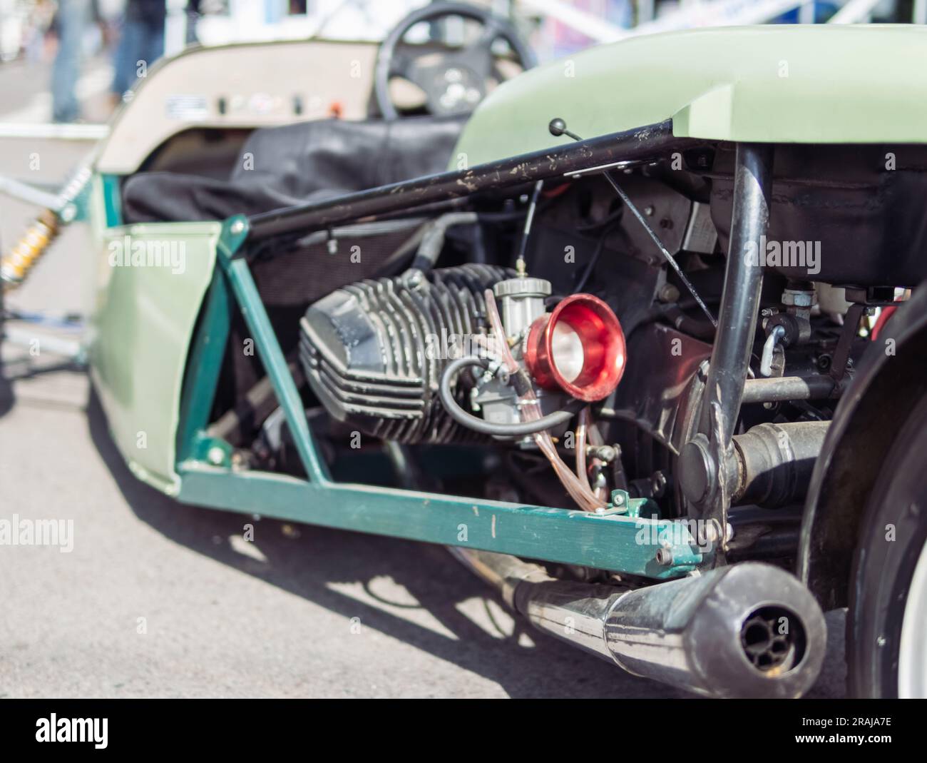 close-up of a motor on a rare racing car, a close-up of a green car ...