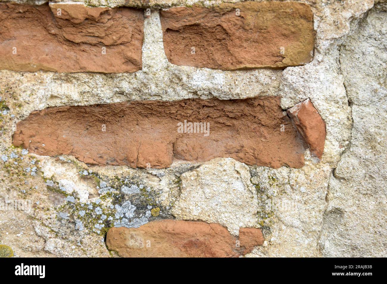 Old Worn Down Brick Wall with Plaster and Moss. Grunge Red Stonewall ...