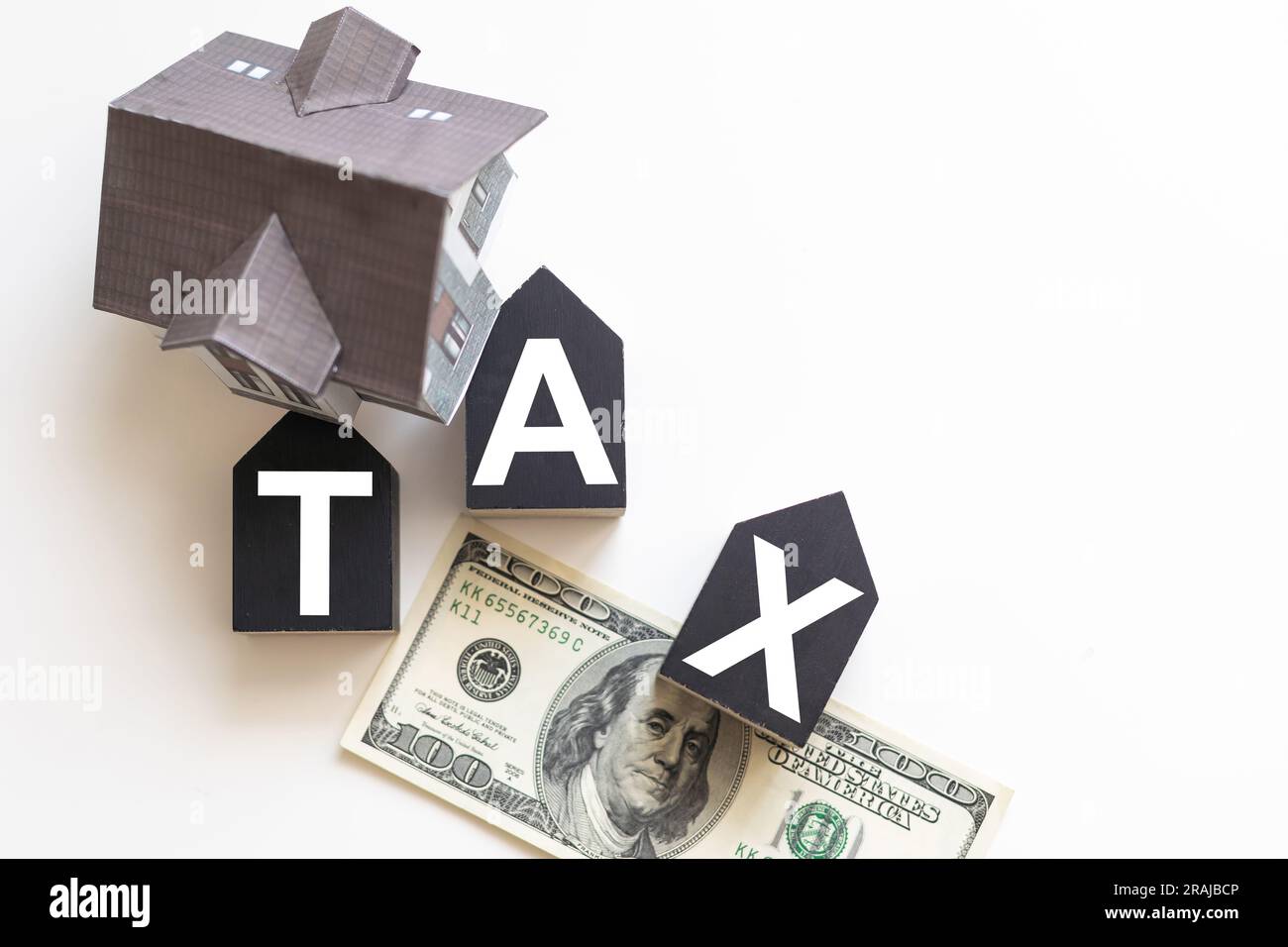 Tax text in wooden cubes and tax or vat form documents to complete ...