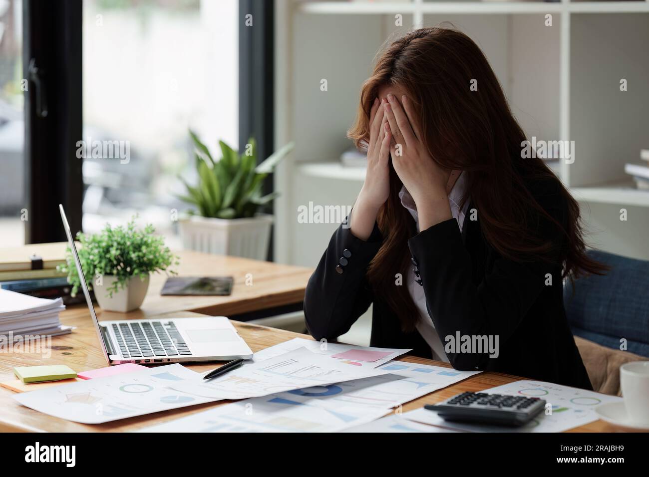 Stressed and Burnout. Business woman worry about her work at office ...