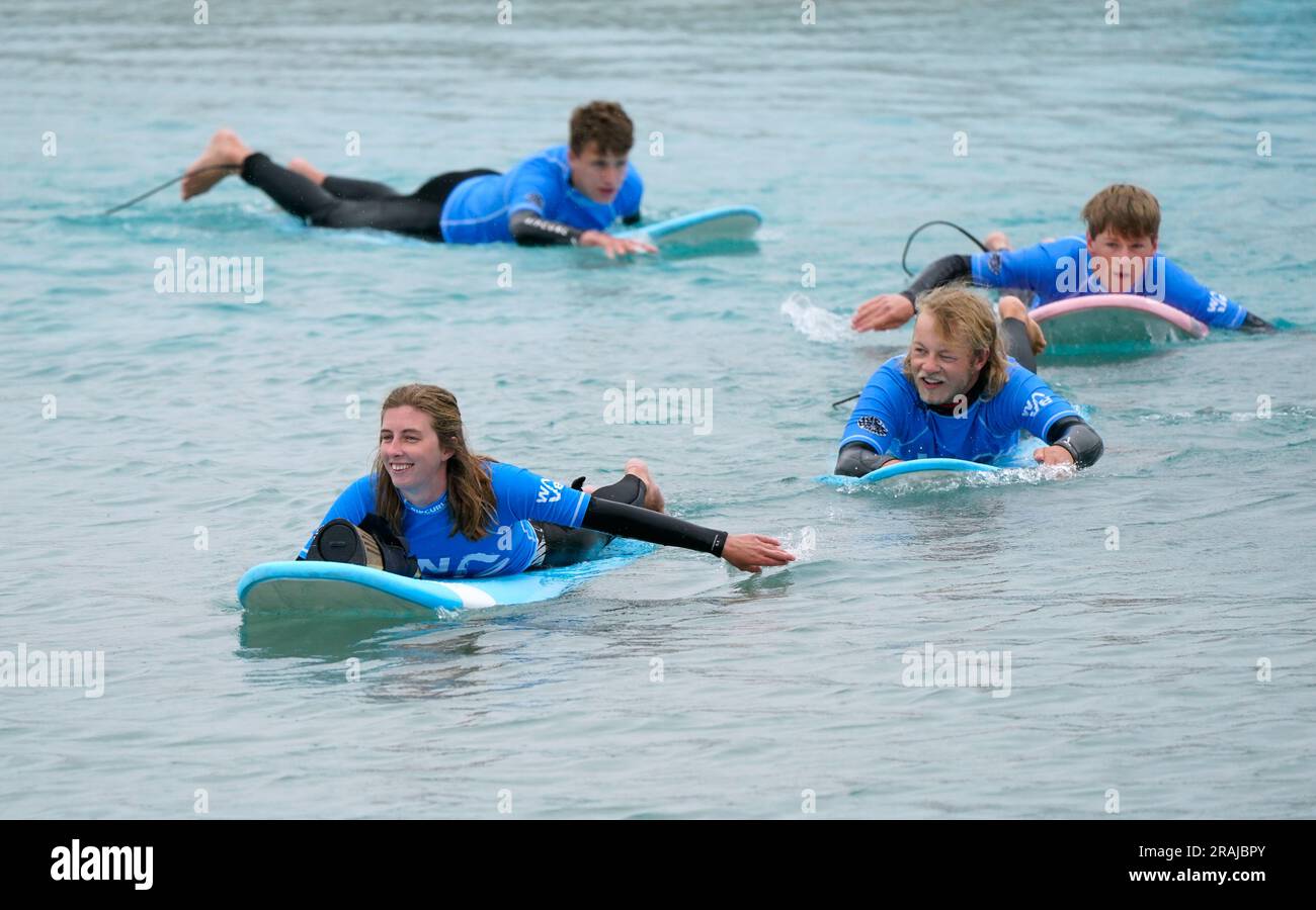 Welsh surfing champion and Wave Surf Coach, Emily Williams, (left ...