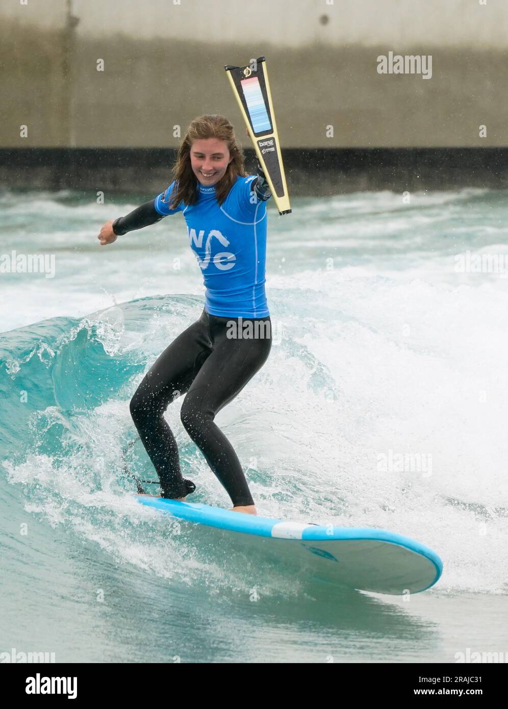 Welsh surfing champion and Wave Surf Coach, Emily Williams, holds the ...