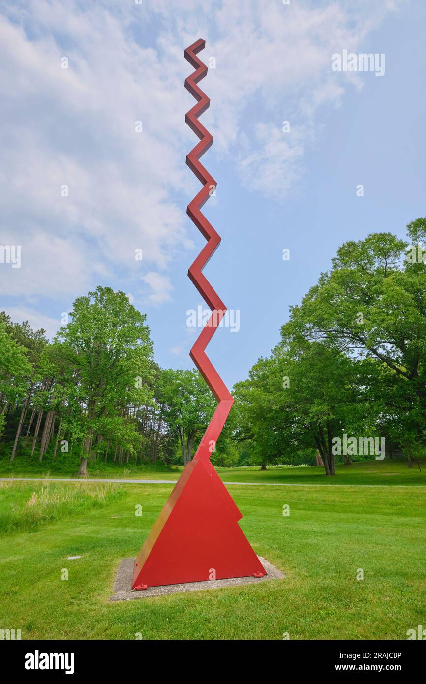 A view of the tall, red, squiggly line sculpture titled Endless Column ...