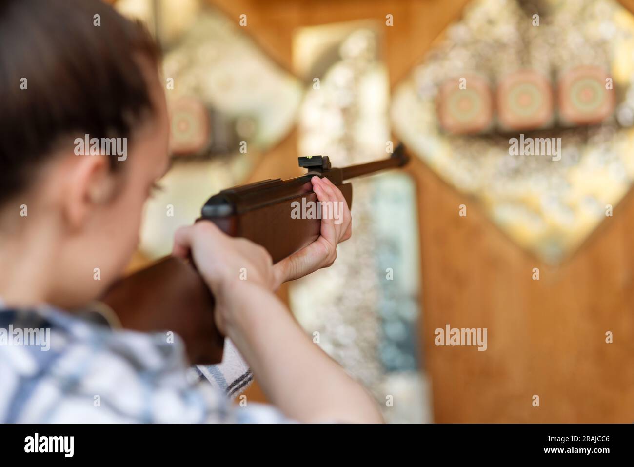 Woman shooting targets hi-res stock photography and images - Alamy