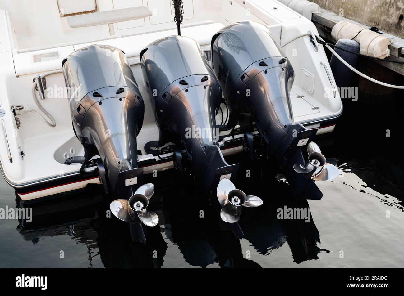 Three outboard boat motor. Selective focus Stock Photo - Alamy