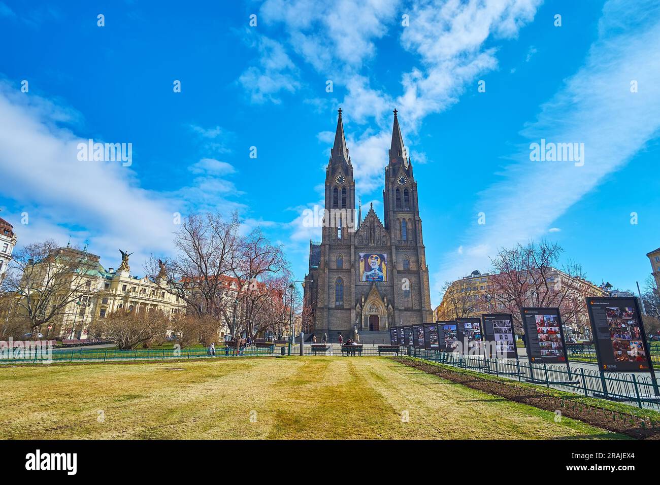 PRAGUE, CZECHIA - MARCH 7, 2022: The green lawn on Peace Square with St ...