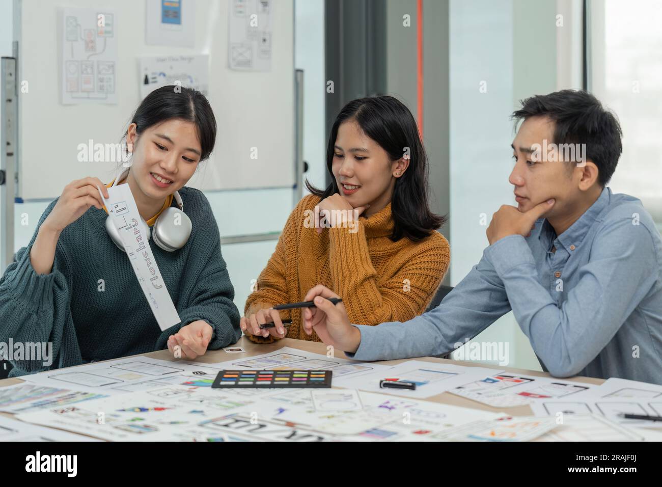 Creative designer choosing color samples for mobile responsive website ...