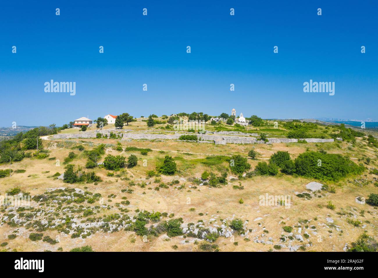 Aerial view of ancient Varvaria historic site on the hill, Dalmatia ...