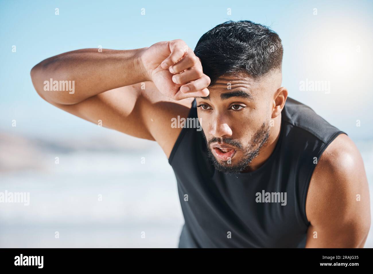 Tired, sweating and fitness break for man outdoor after training ...