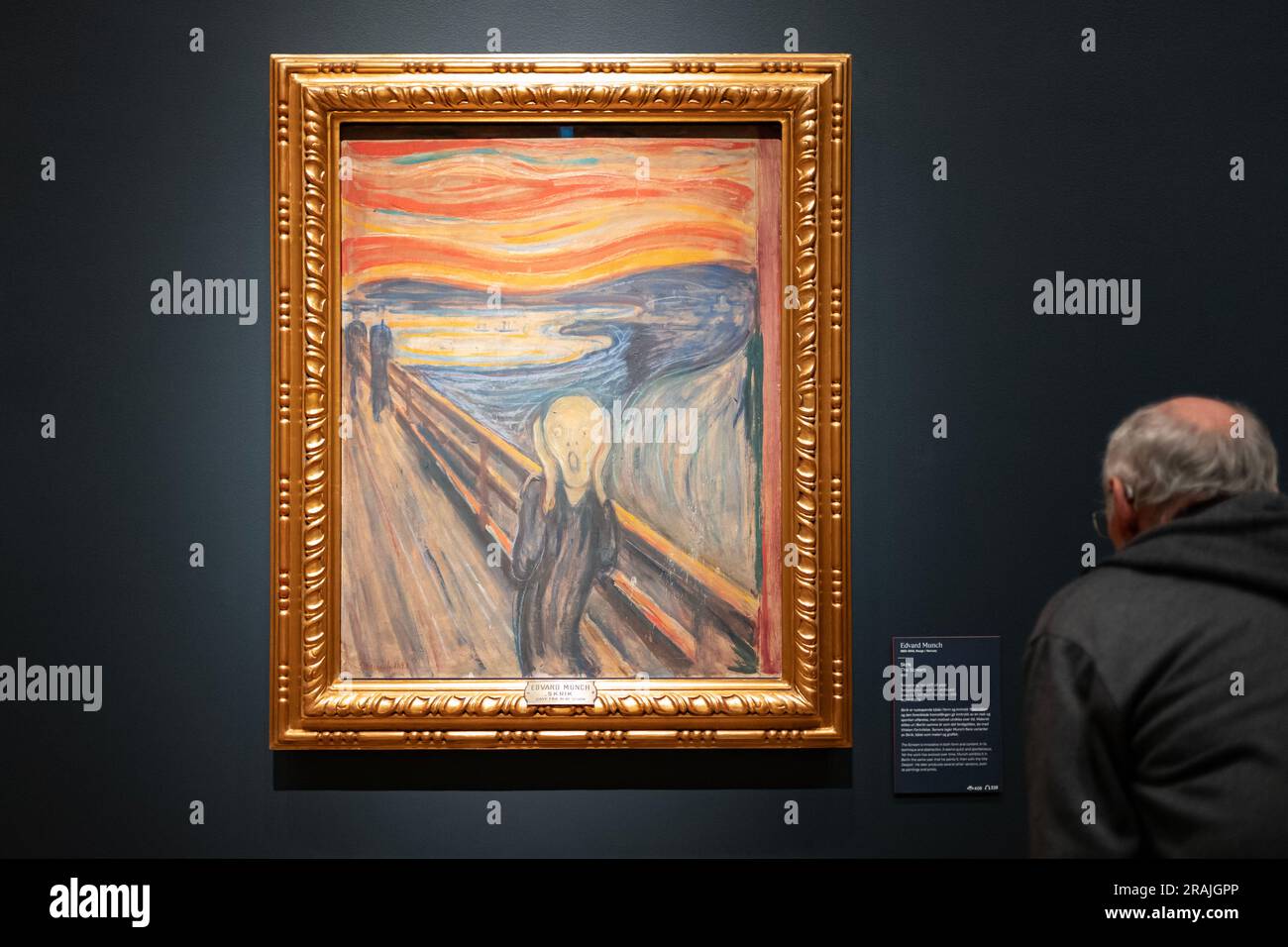 Oslo, Norway, June 20, 2023: A tourist observes the famous Edvard Munch ...