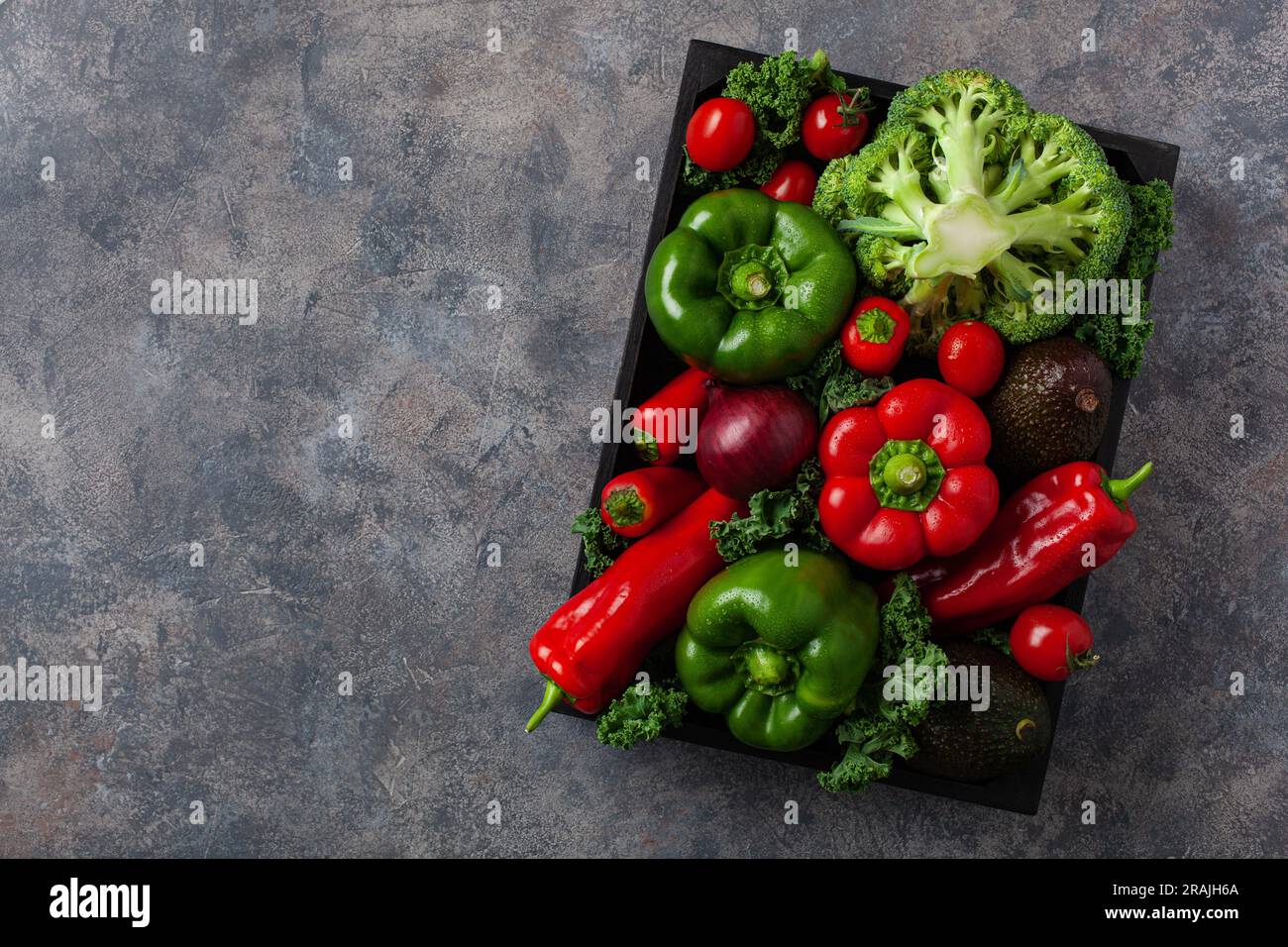 assorted red and green vegetables tomatoes, bell peppers, kale avocado ...