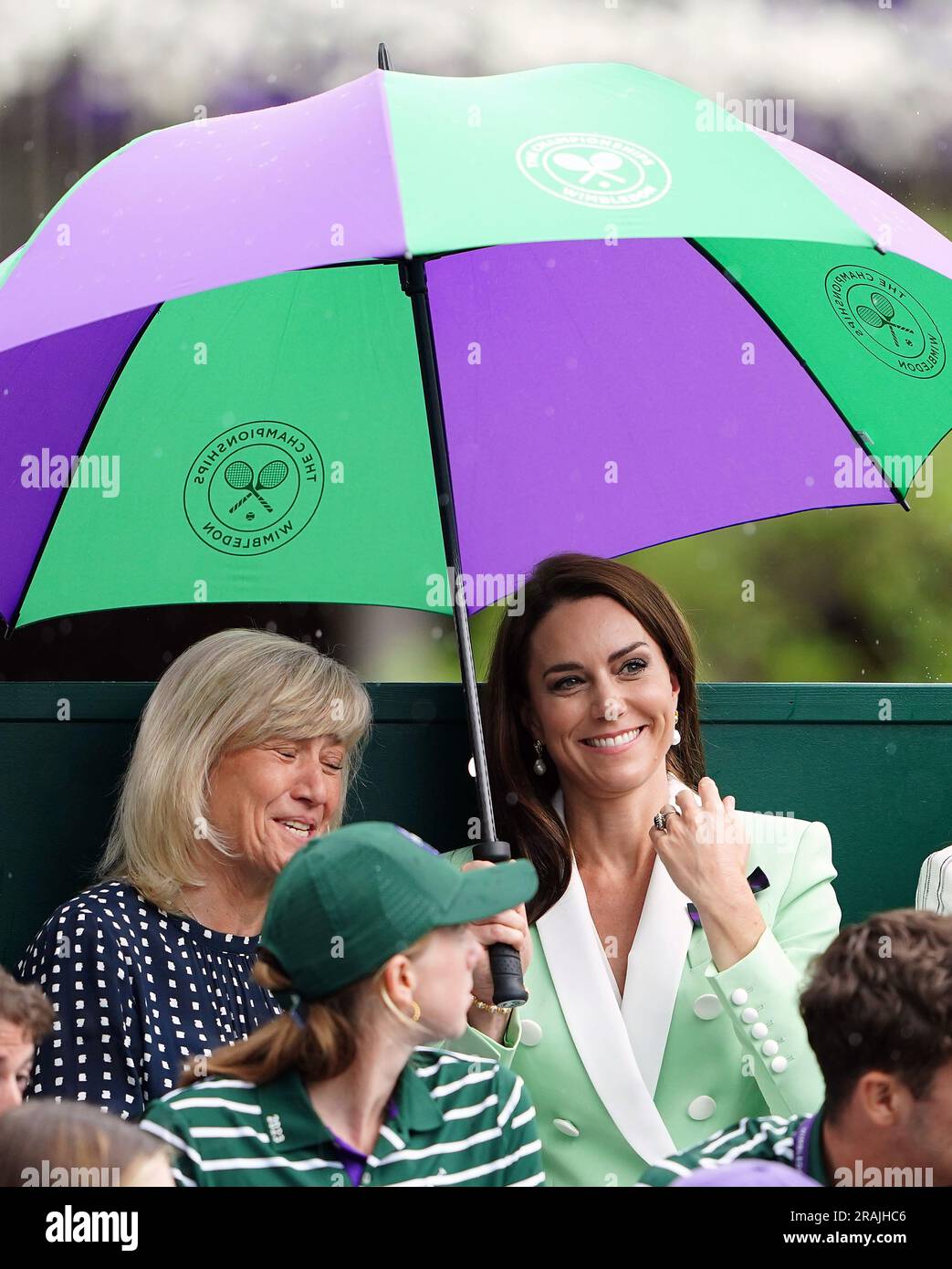 The Princess of Wales under an umbrella with Deborah Jevans before rain ...