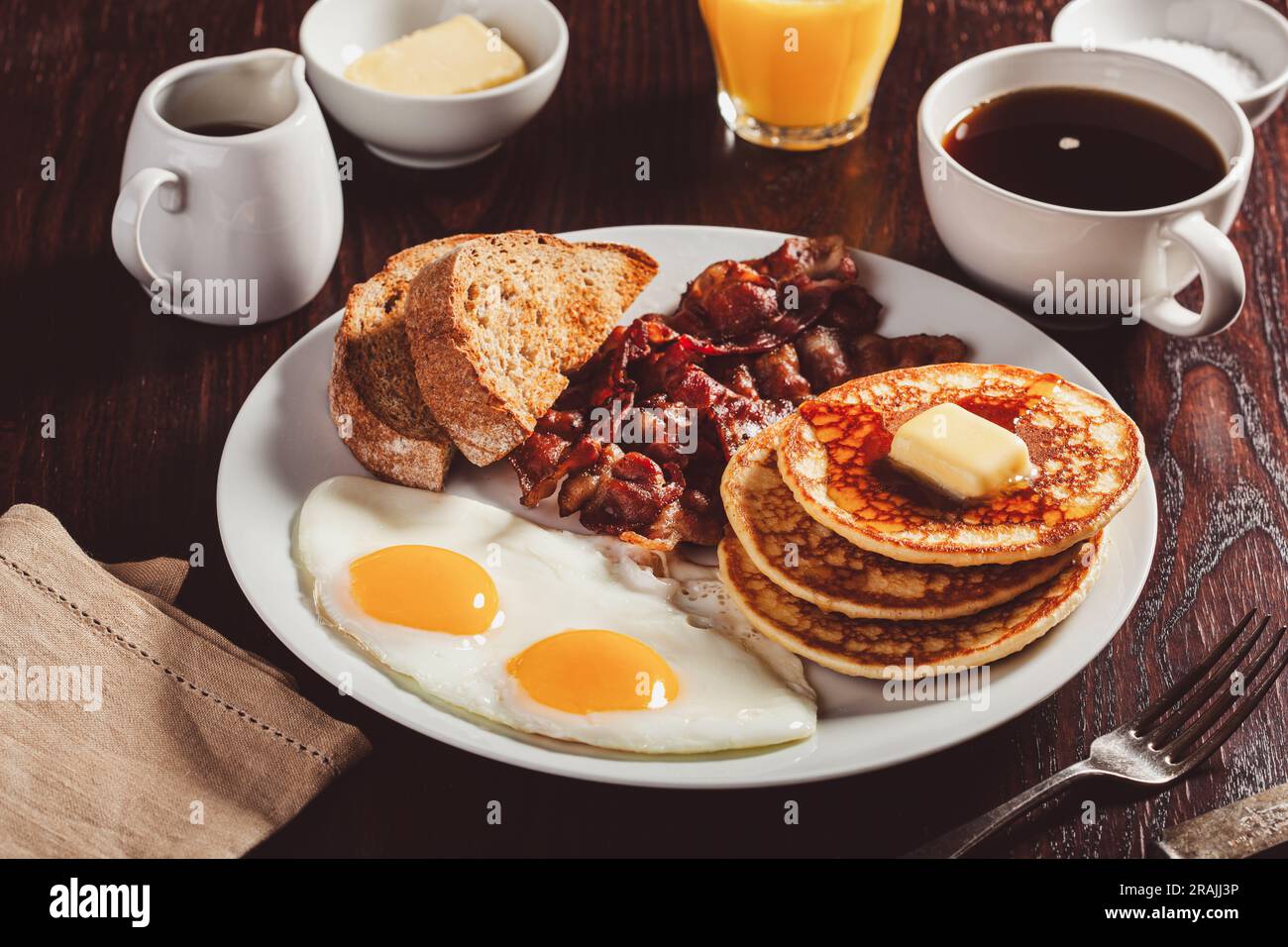 traditional full american breakfast eggs pancakes with bacon and toast ...