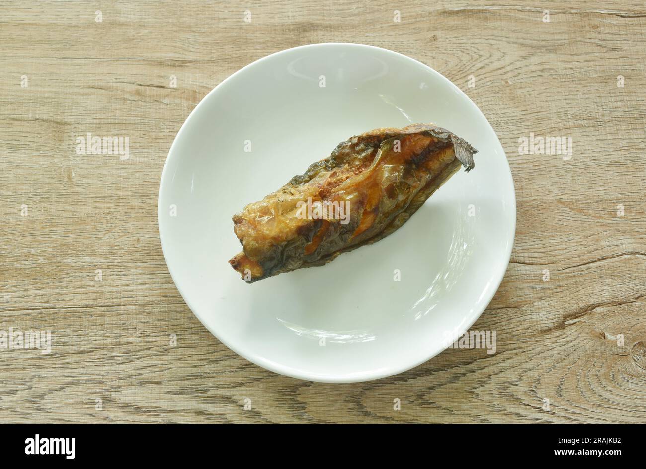 deep fried snake skin catfish arranging on dish Stock Photo - Alamy