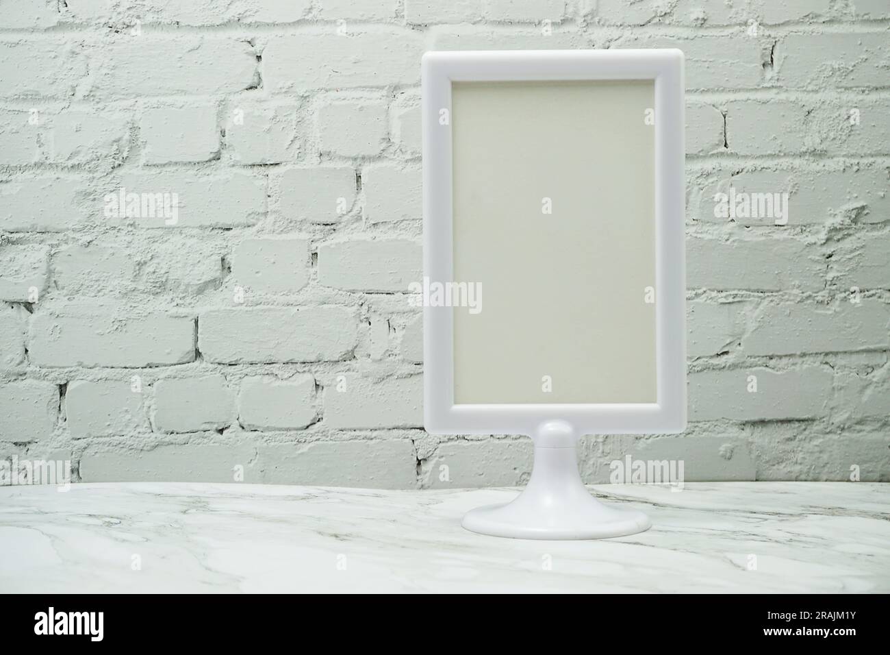 Blank Display frame stand on wooden background Stock Photo - Alamy