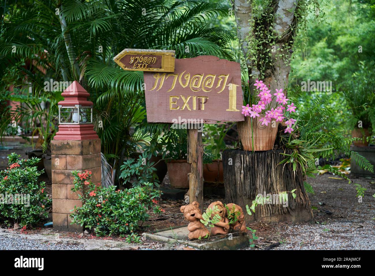 A beautiful exit sign at a resort hotel, taken in Thailand Stock Photo ...