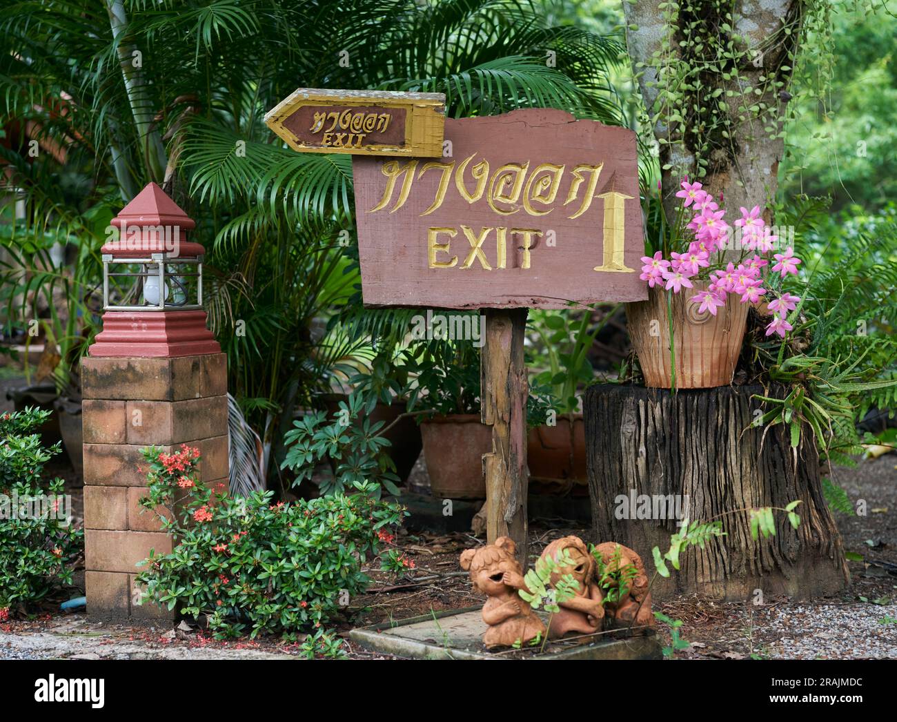 A beautiful exit sign at a resort hotel, taken in Thailand Stock Photo ...