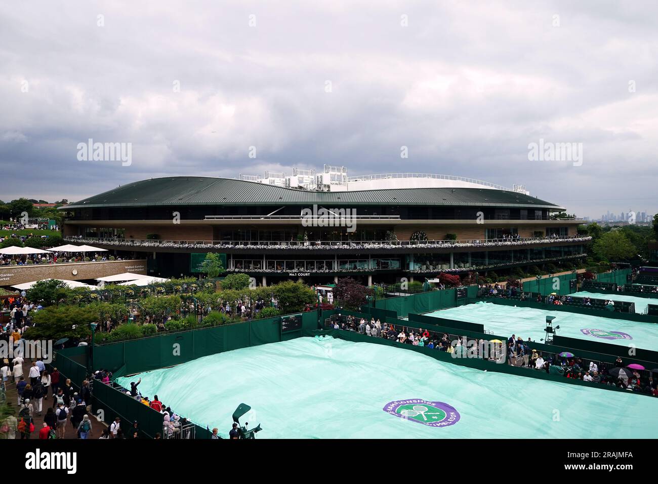 General view of covers on the outside courts as rain stops play on day ...